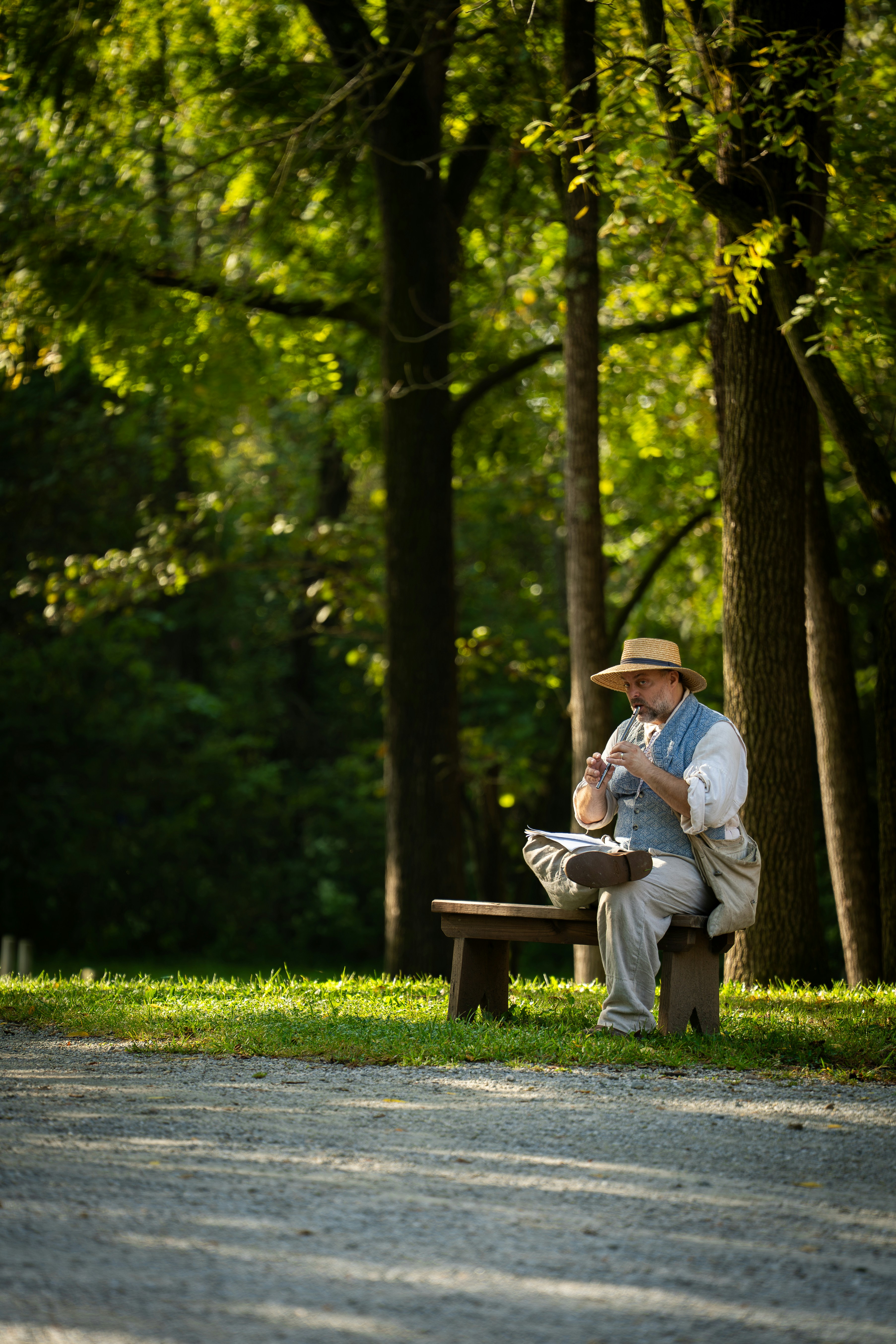 Forest Bench Portrait: A Gentle Worker in Sunlit Dappled Light