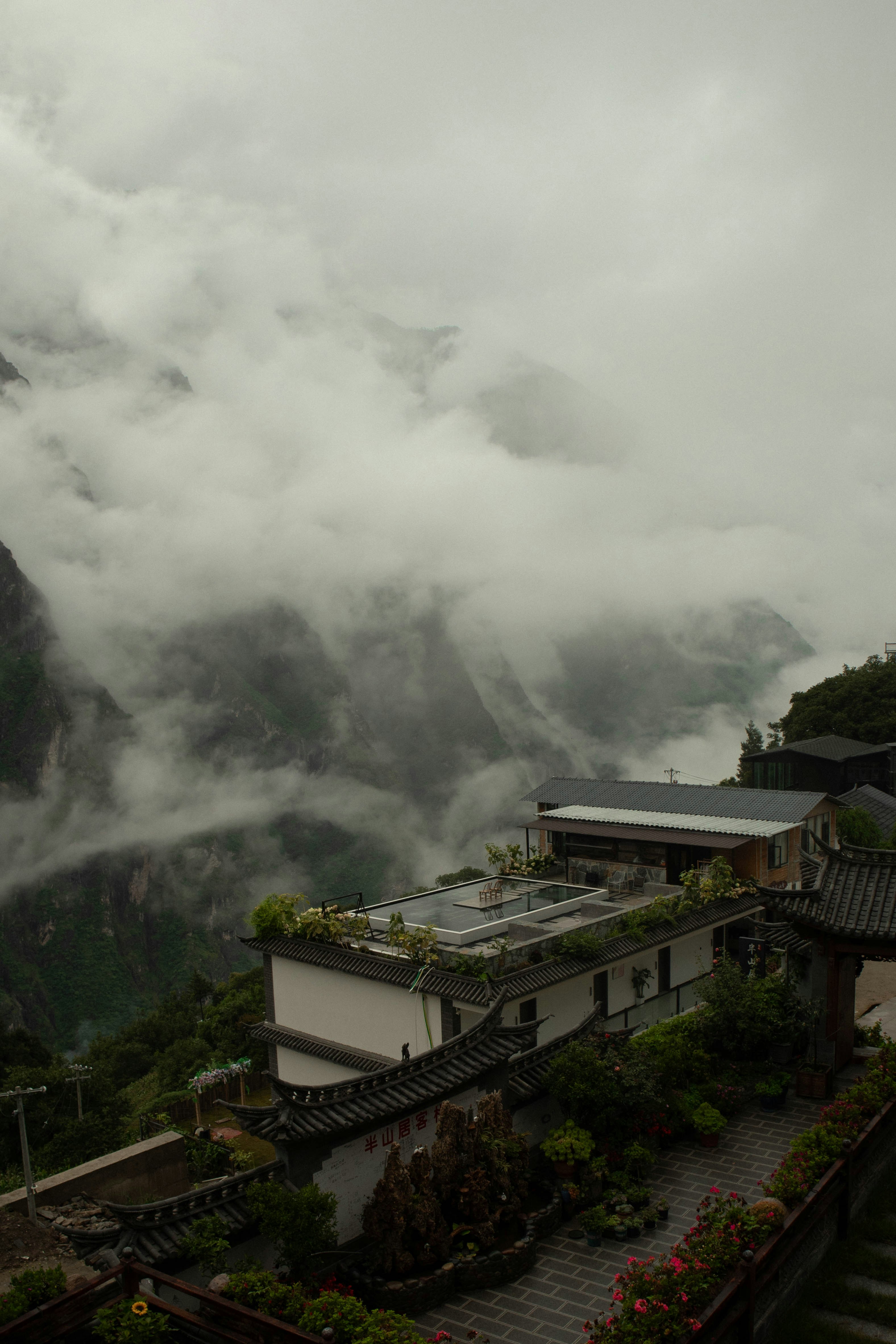 Cloud-veiled village perched on the mountainside