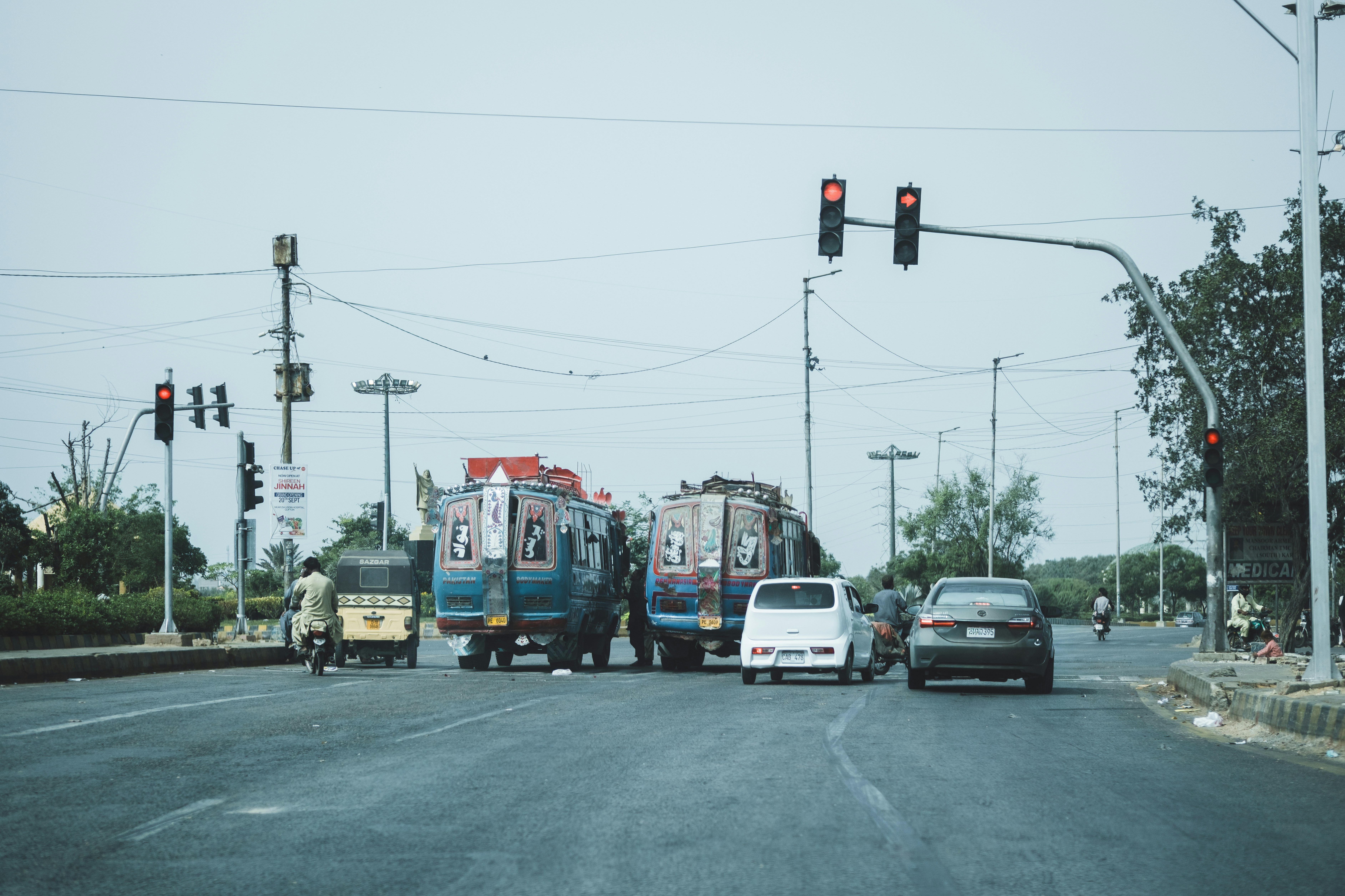 Toward the Junction: A Busy Street with Trams and Watchful Signals