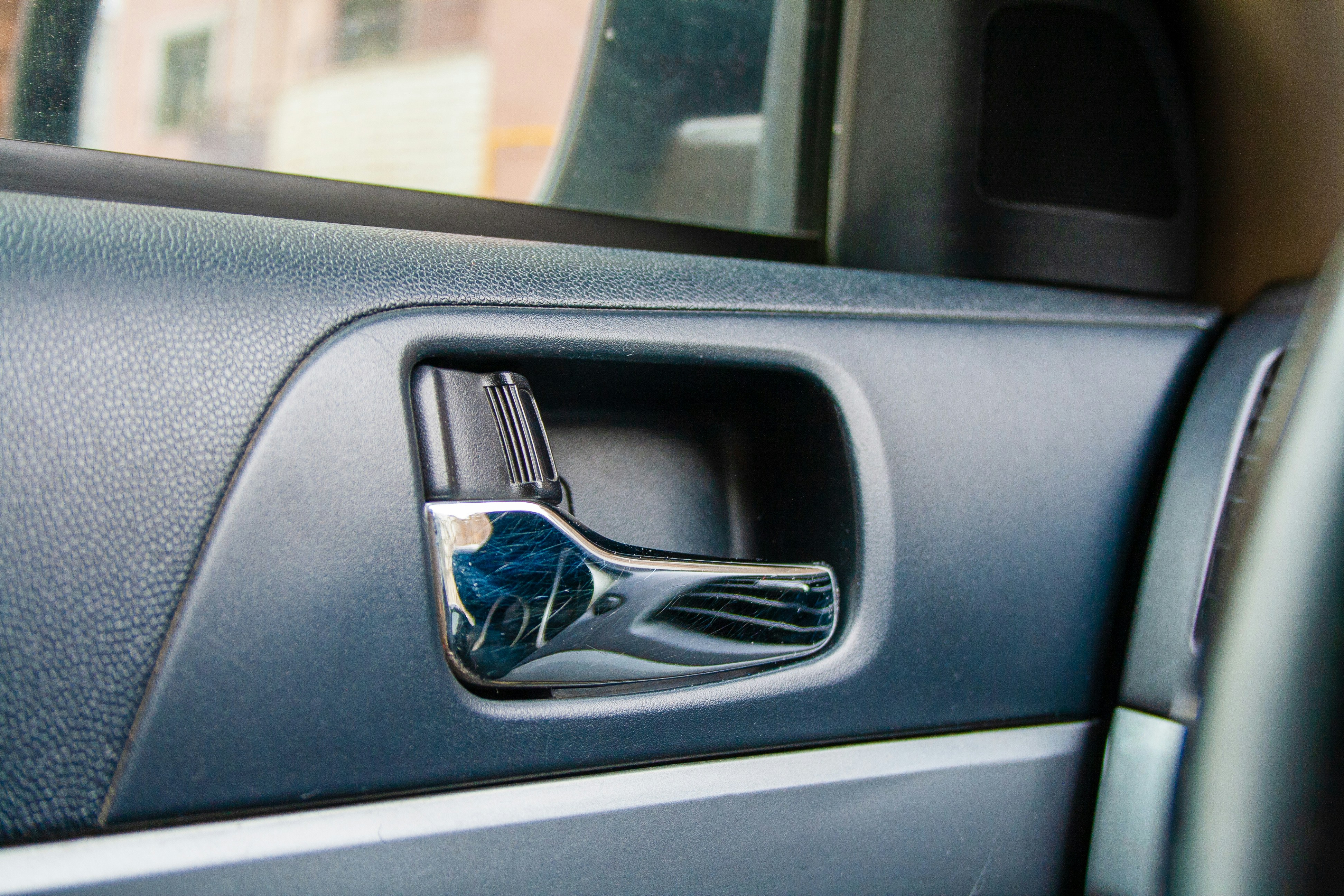 Chrome Door Handle Reflections: A Quiet Car Interior Detail