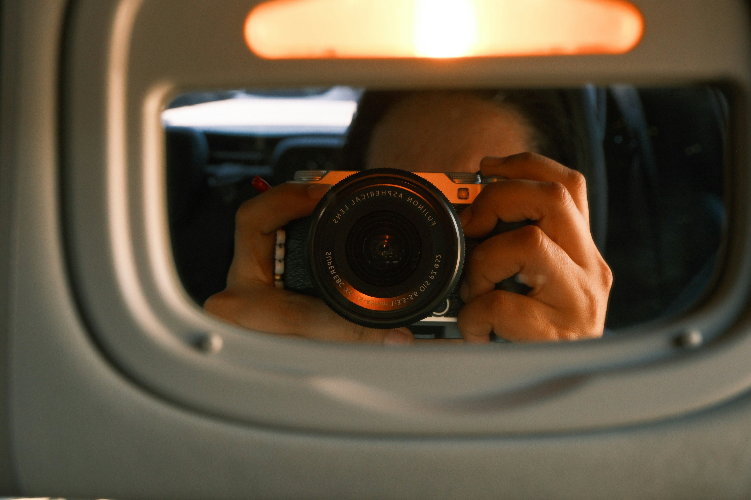 Through the Lens: a mirrored self-portrait in a cabin of light