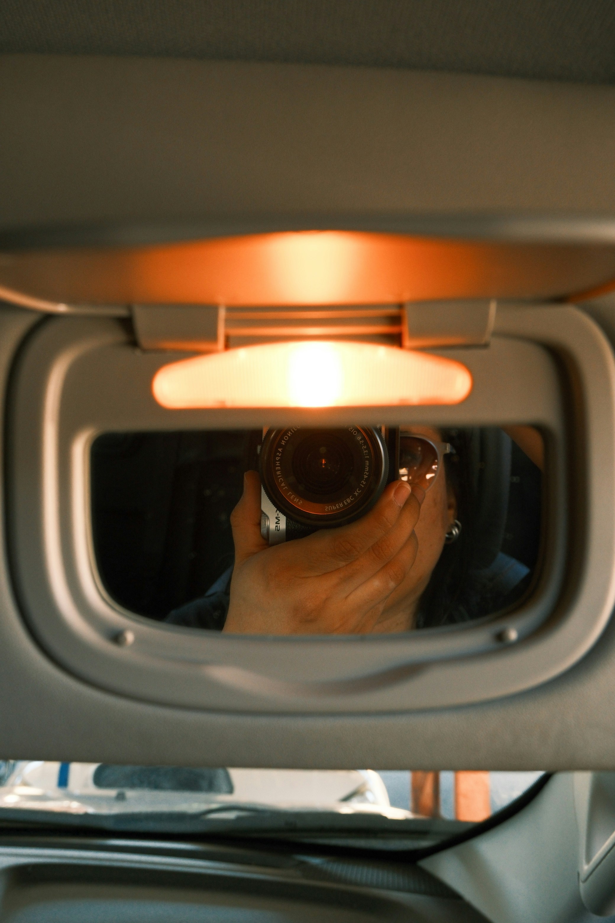 Reflection in the Car: A Photographer’s View Through the Dashboard Window