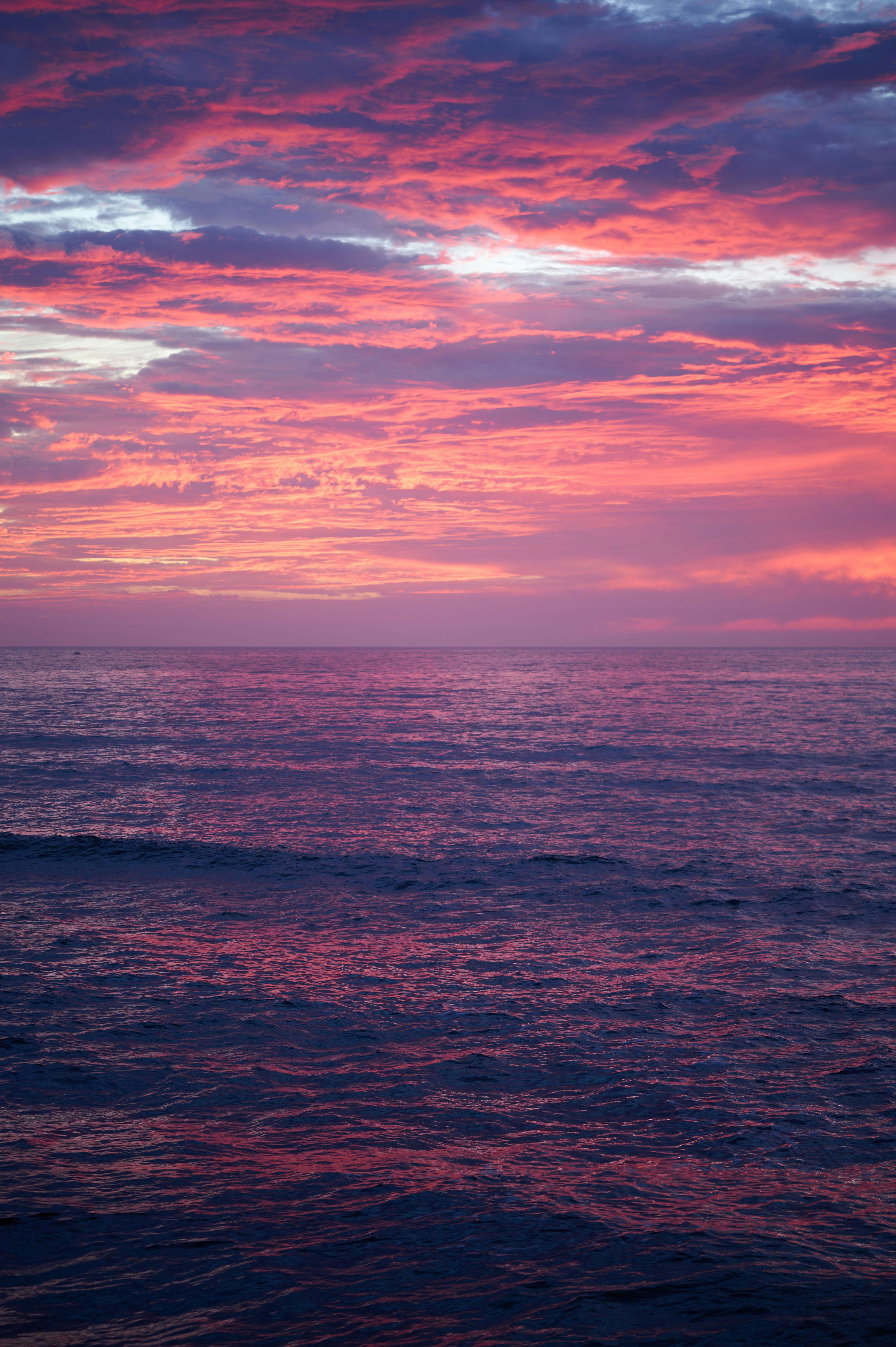 Crimson Horizon over Calm Seas at Dusk