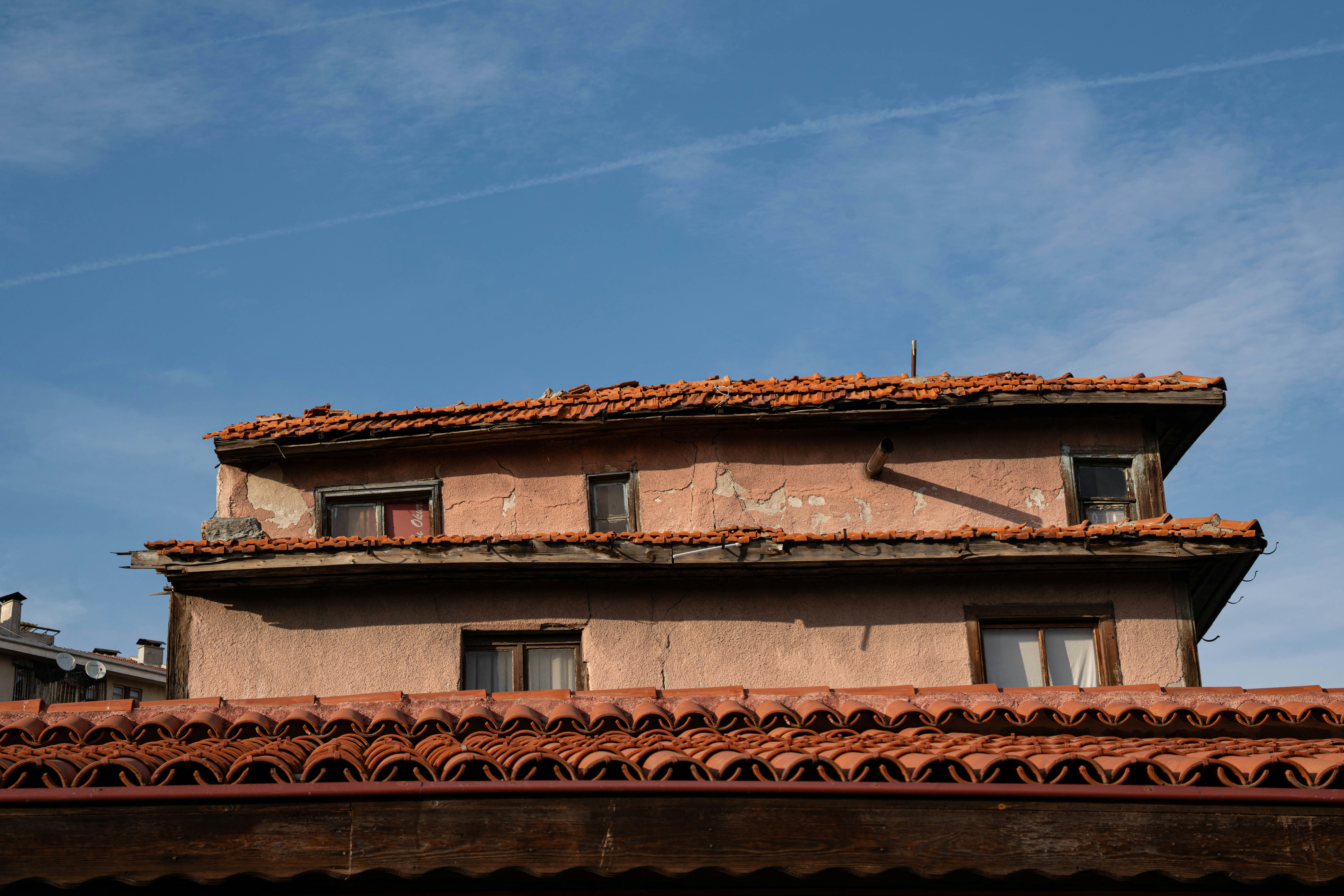 Terracotta Roofline Under a Clear Sky