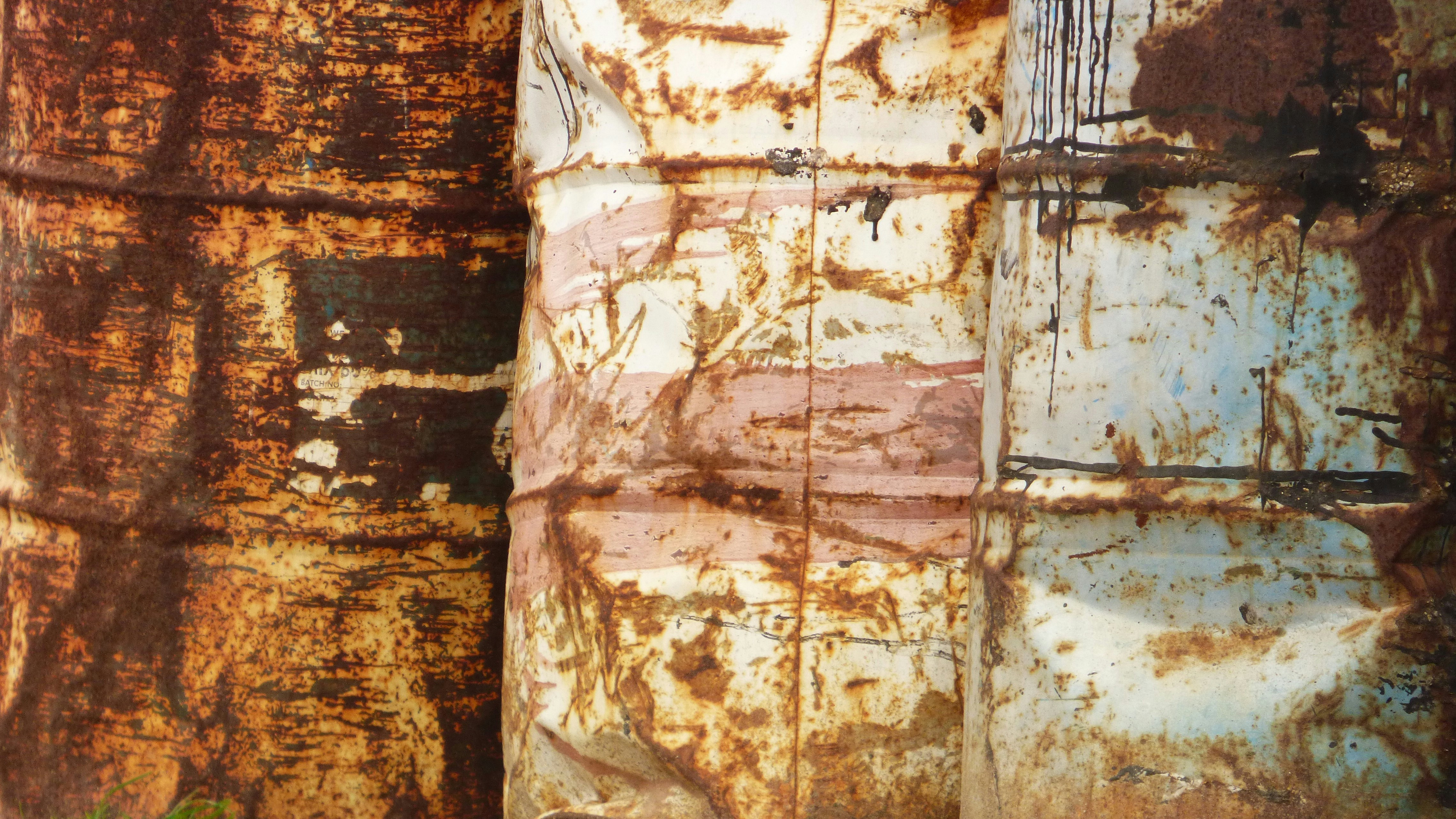 Rust Mosaic: A Close-Up of Weathered Metal Panels
