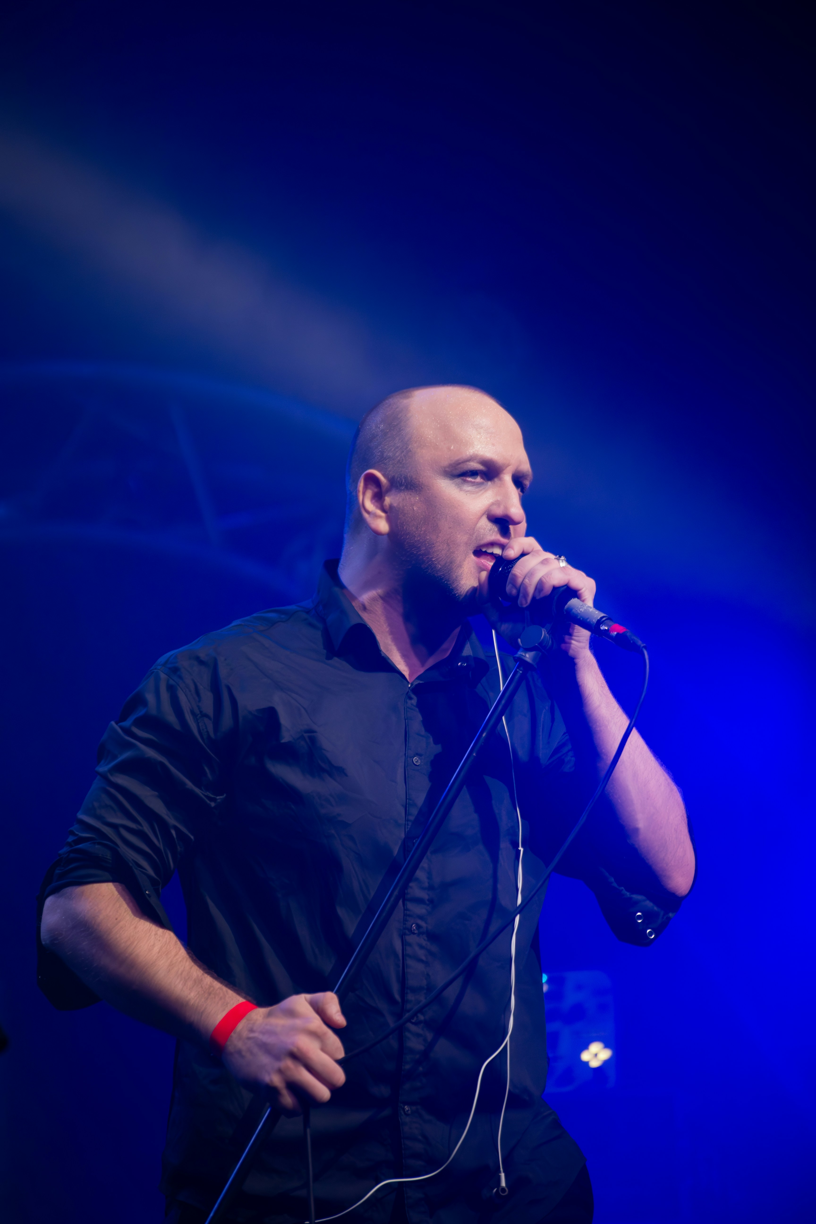 Midnight Blizzard: A Vocal Moment Under Blue Stage Lights