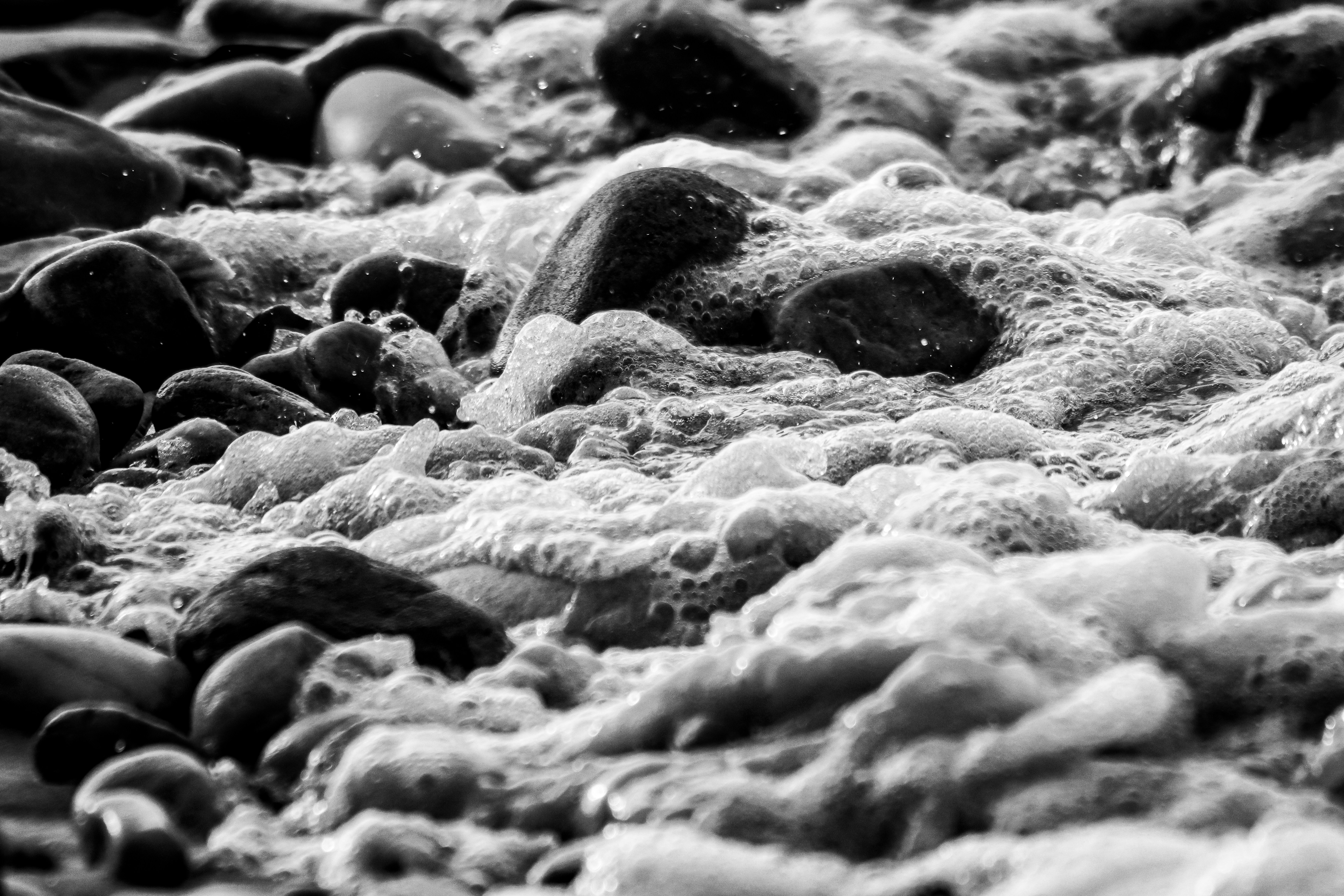 Rushing Pebble Mosaic: Quiet Waves in Monochrome