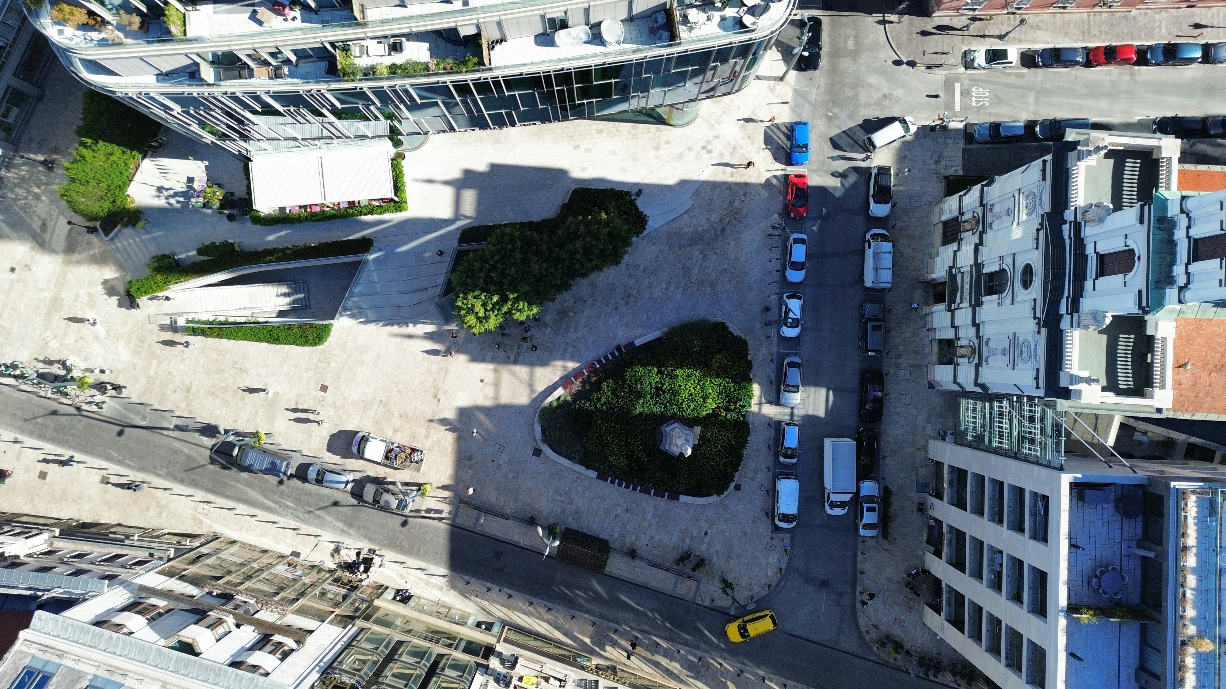Urban Spiral: A Bird’s-Eye View of a Central Courtyard Ringed by Glass and Stone