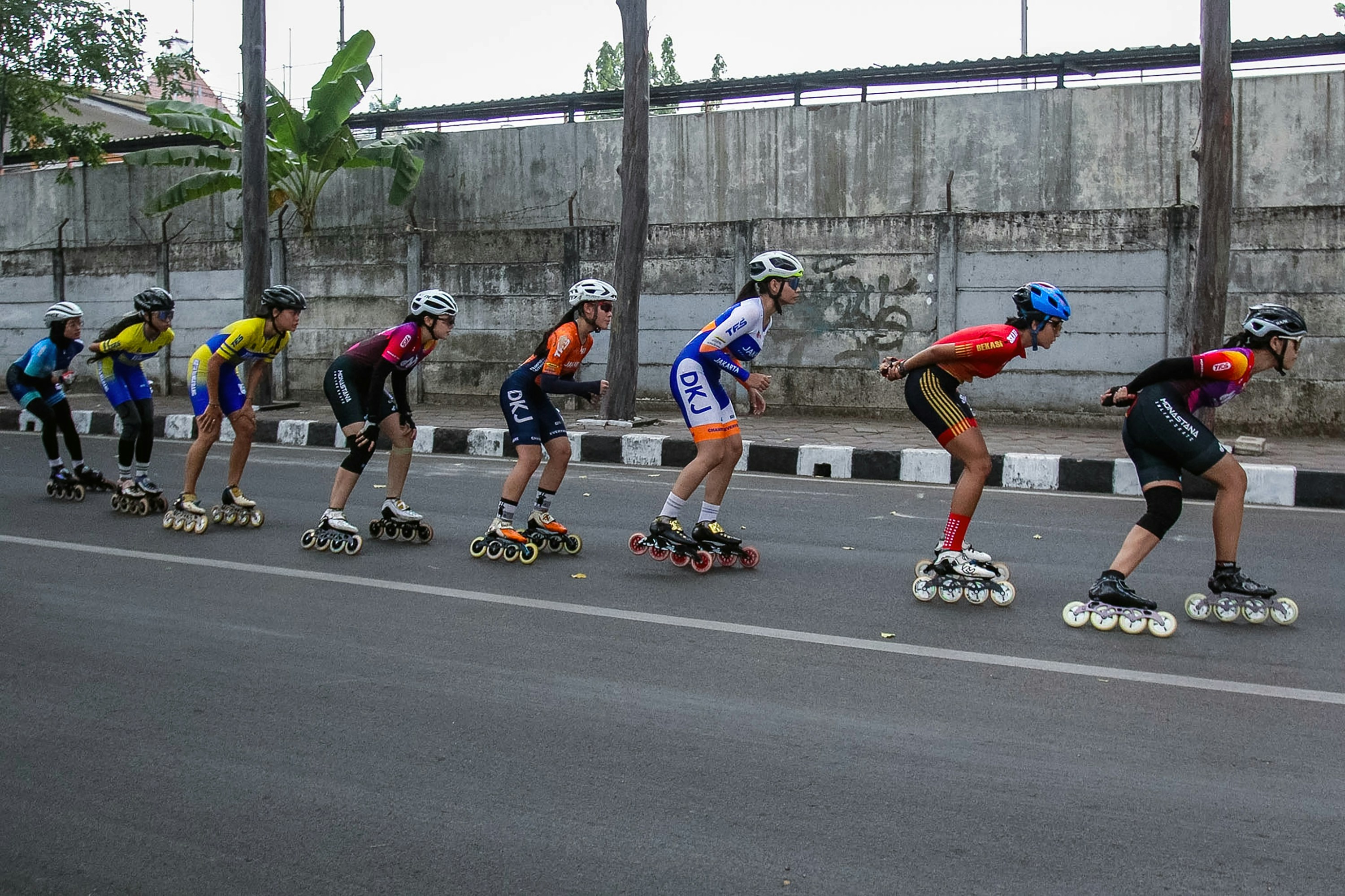 Roller Derby Relay: A Line of Speedy Wheels Across the Asphalt