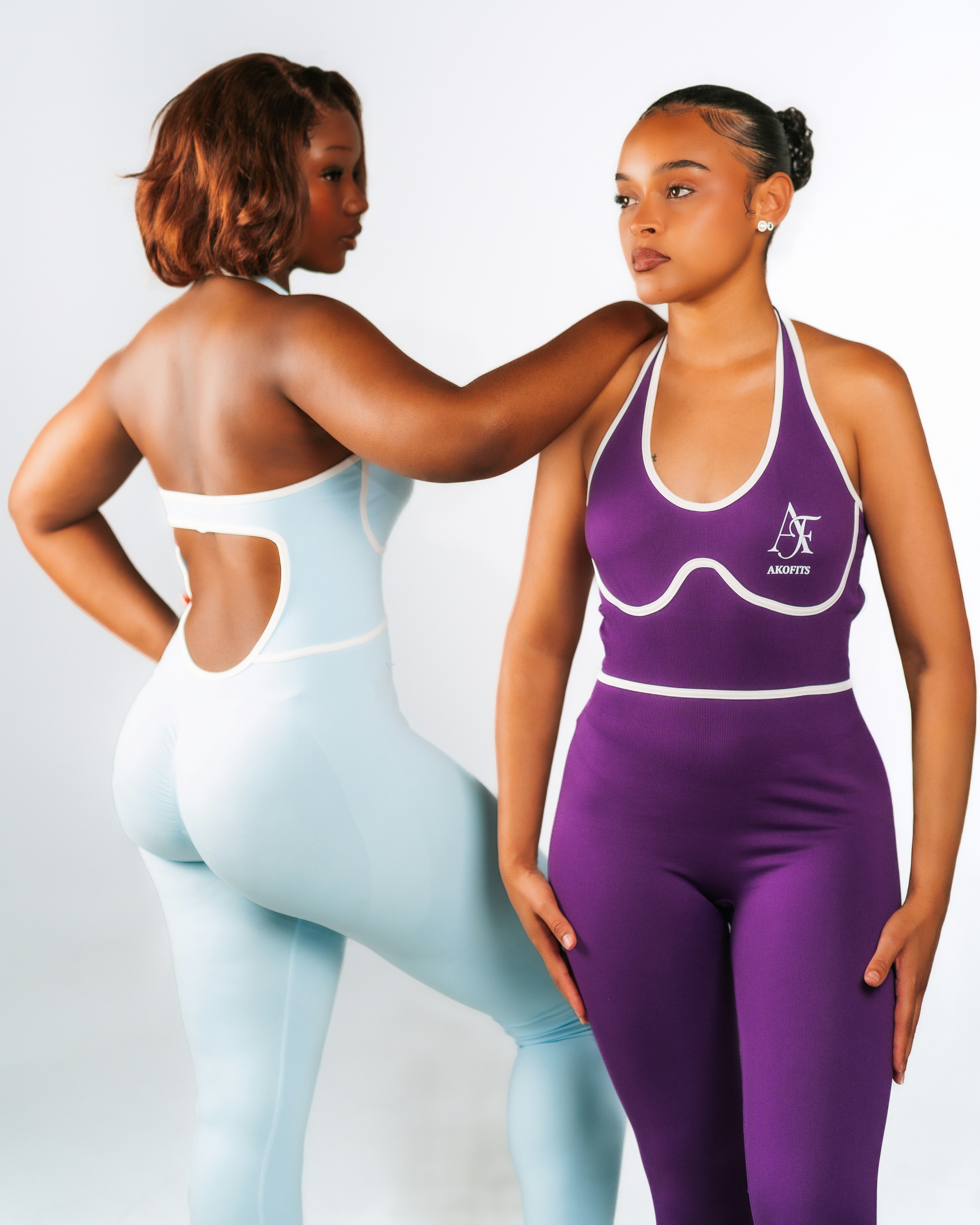 Contrast in Motion: Two Athletes in Colorful Leotards