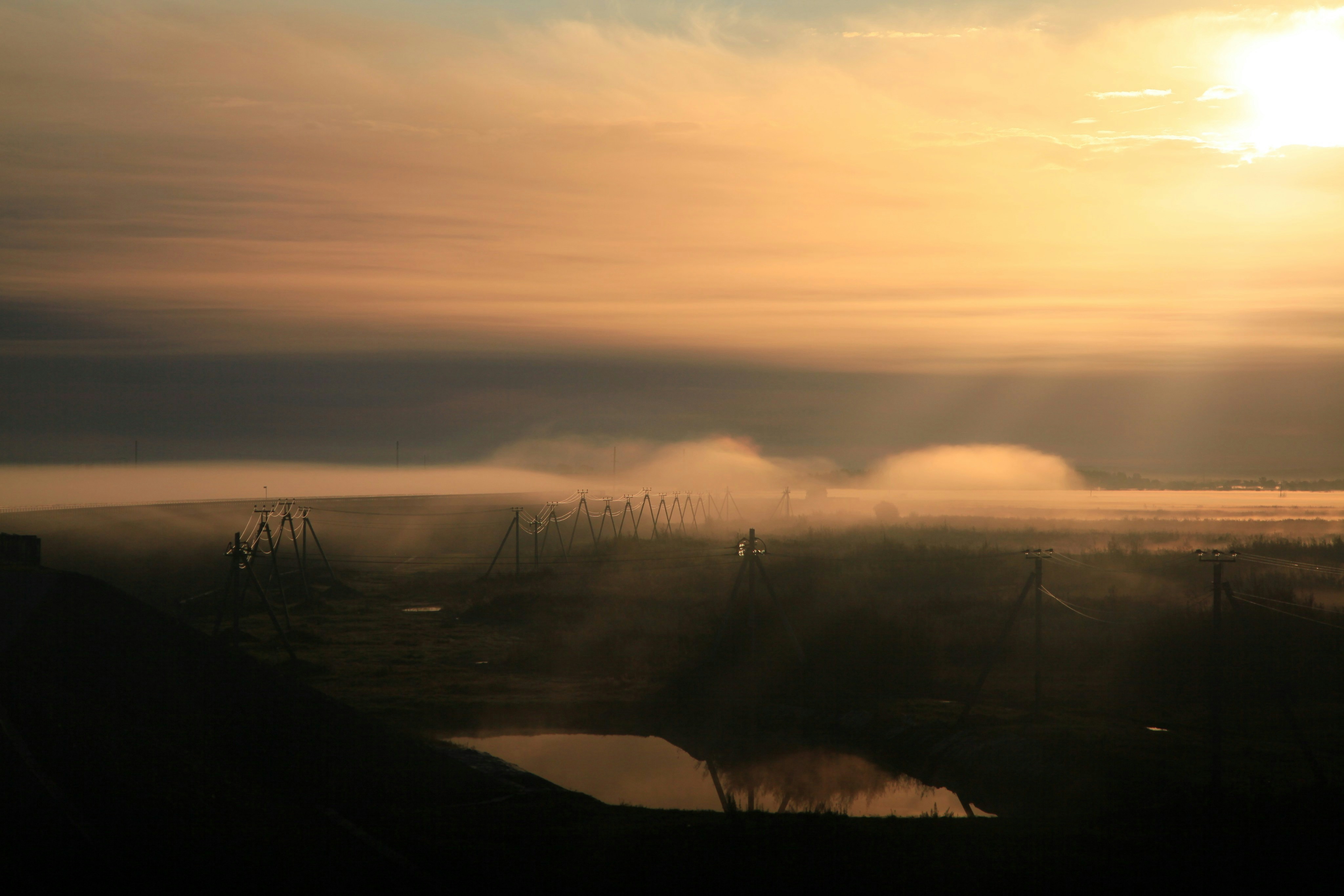 Dawn on Misty Dunes: Faint Lines of Light Over a Quiet Shore