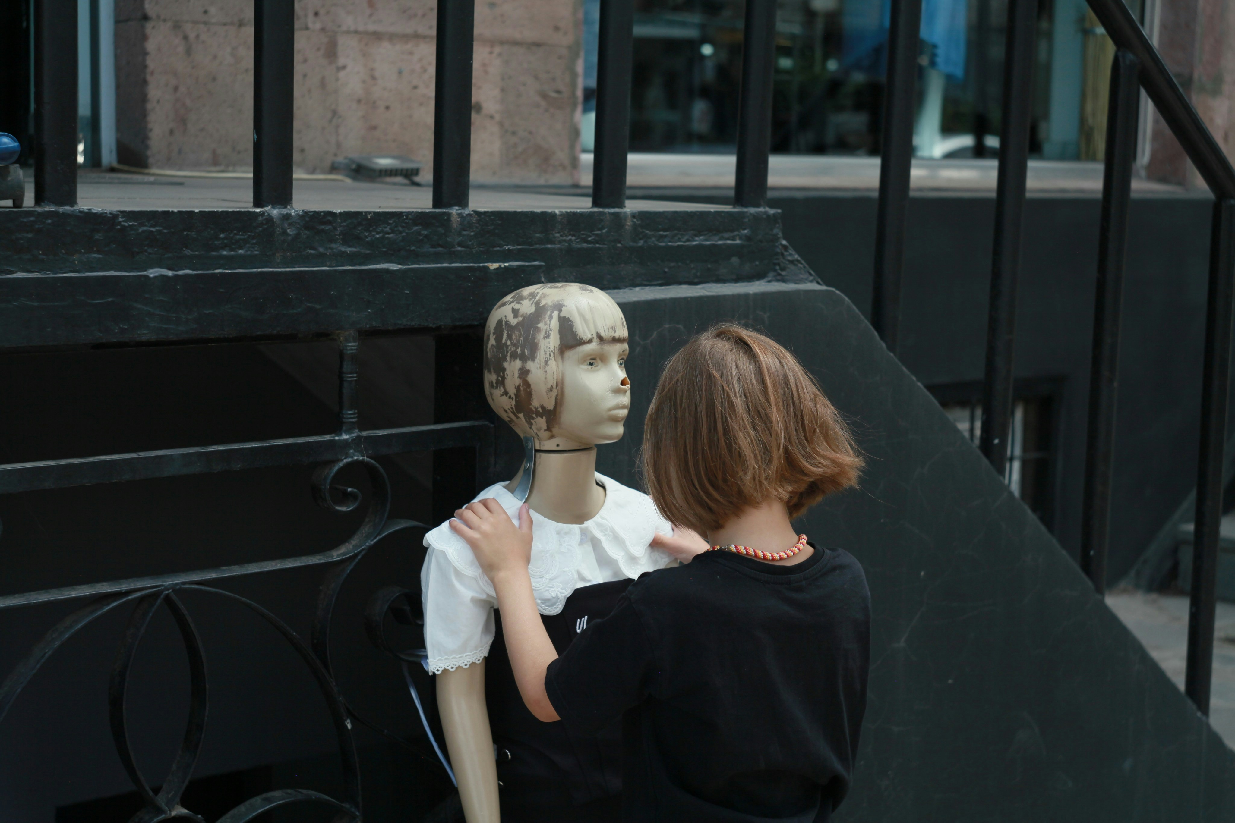Silent Exchange: A Doll Meets Human in an Urban Corner