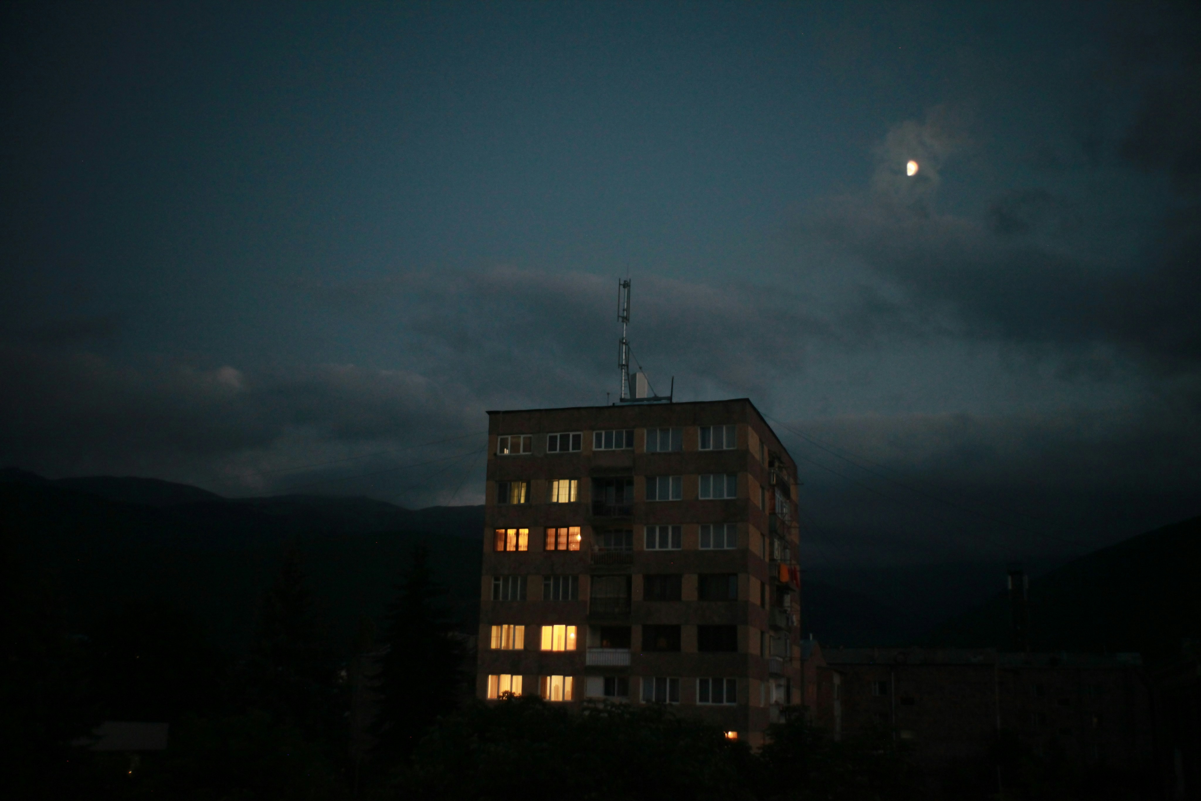 Moonlit Sky over a Quiet Apartment Block