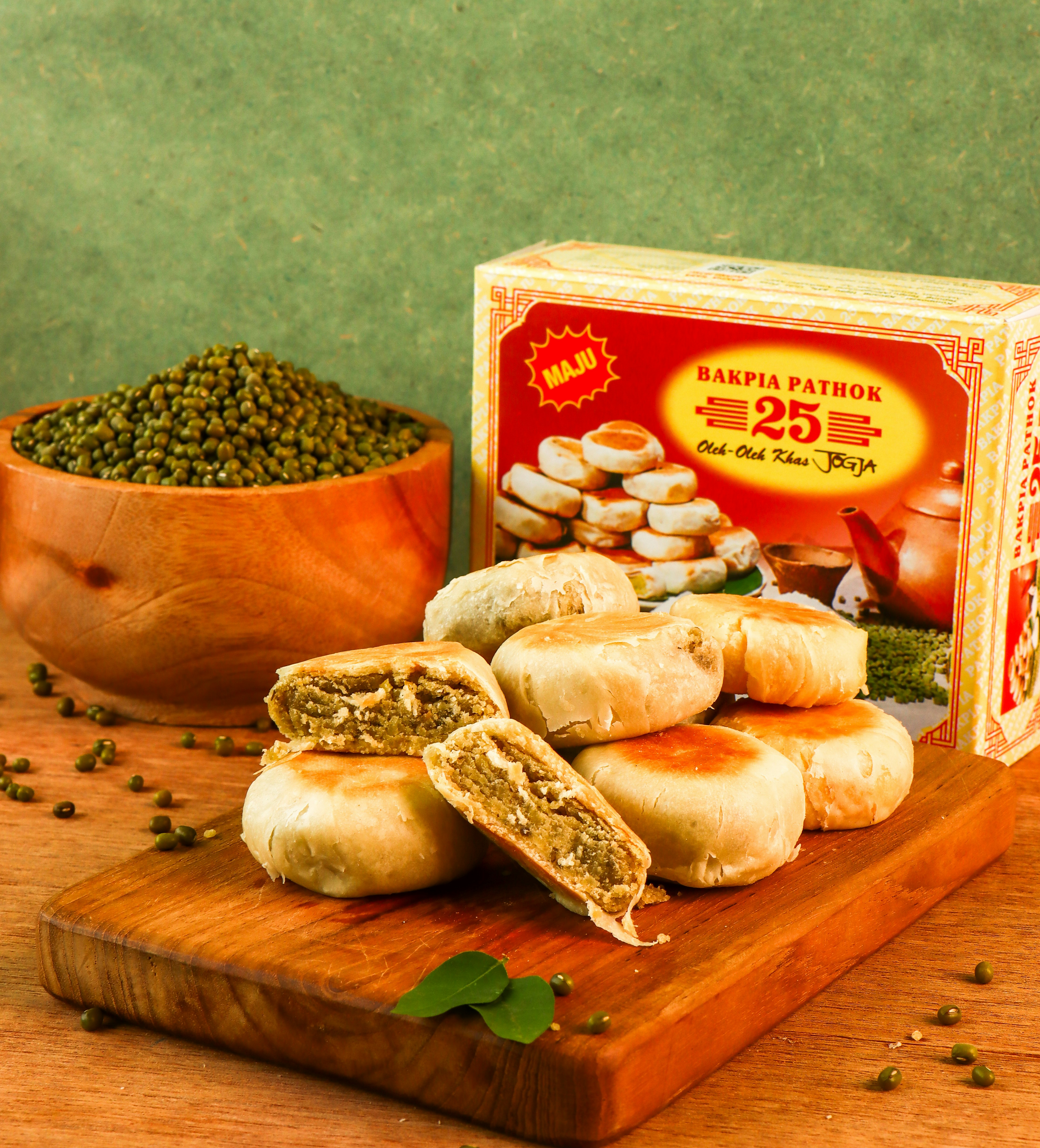 Golden Pastries on a Rustic Board with a Spiced Pepper Box