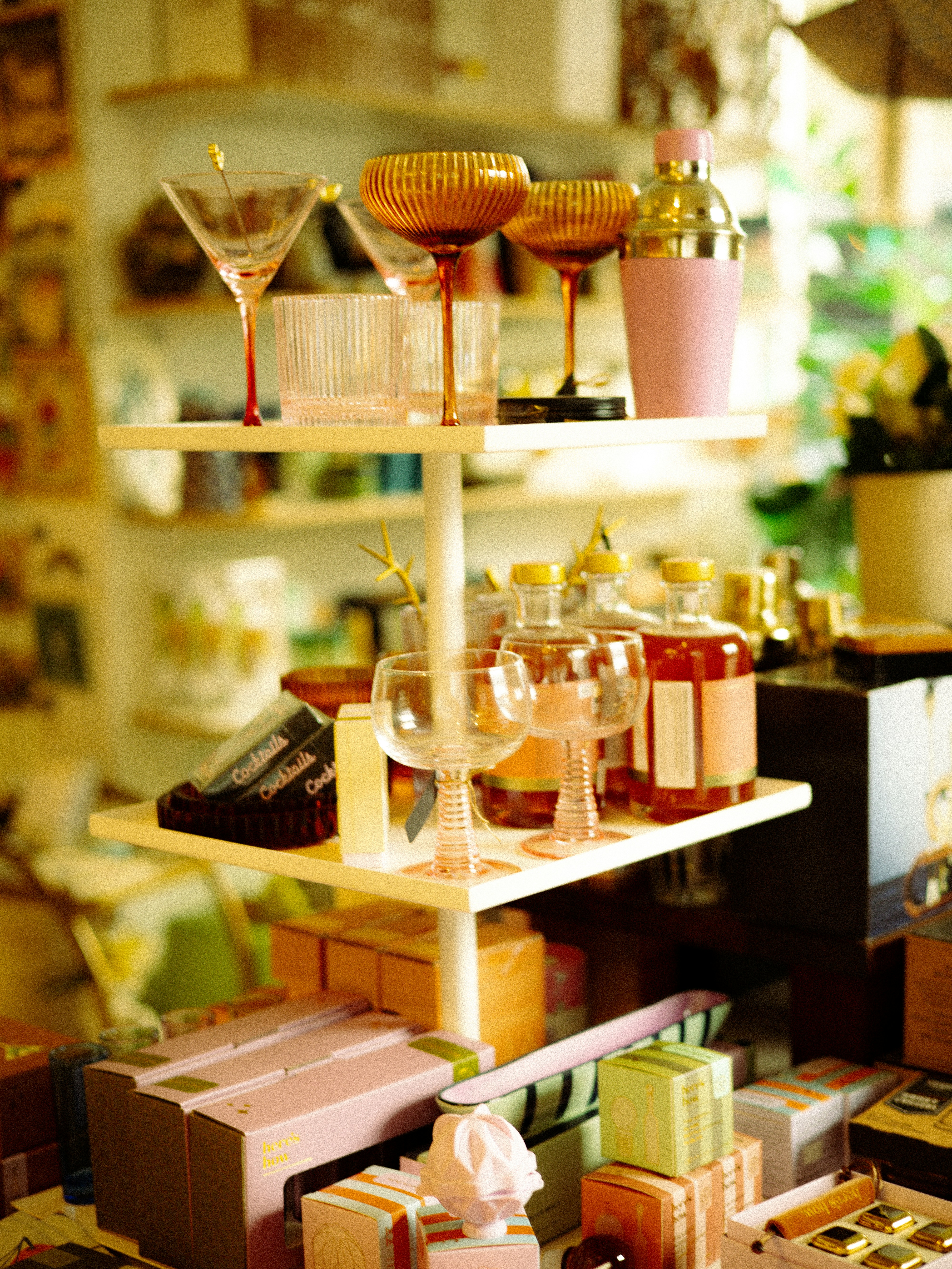 Pastel Bar Cart of Glassware in a Cozy Shop