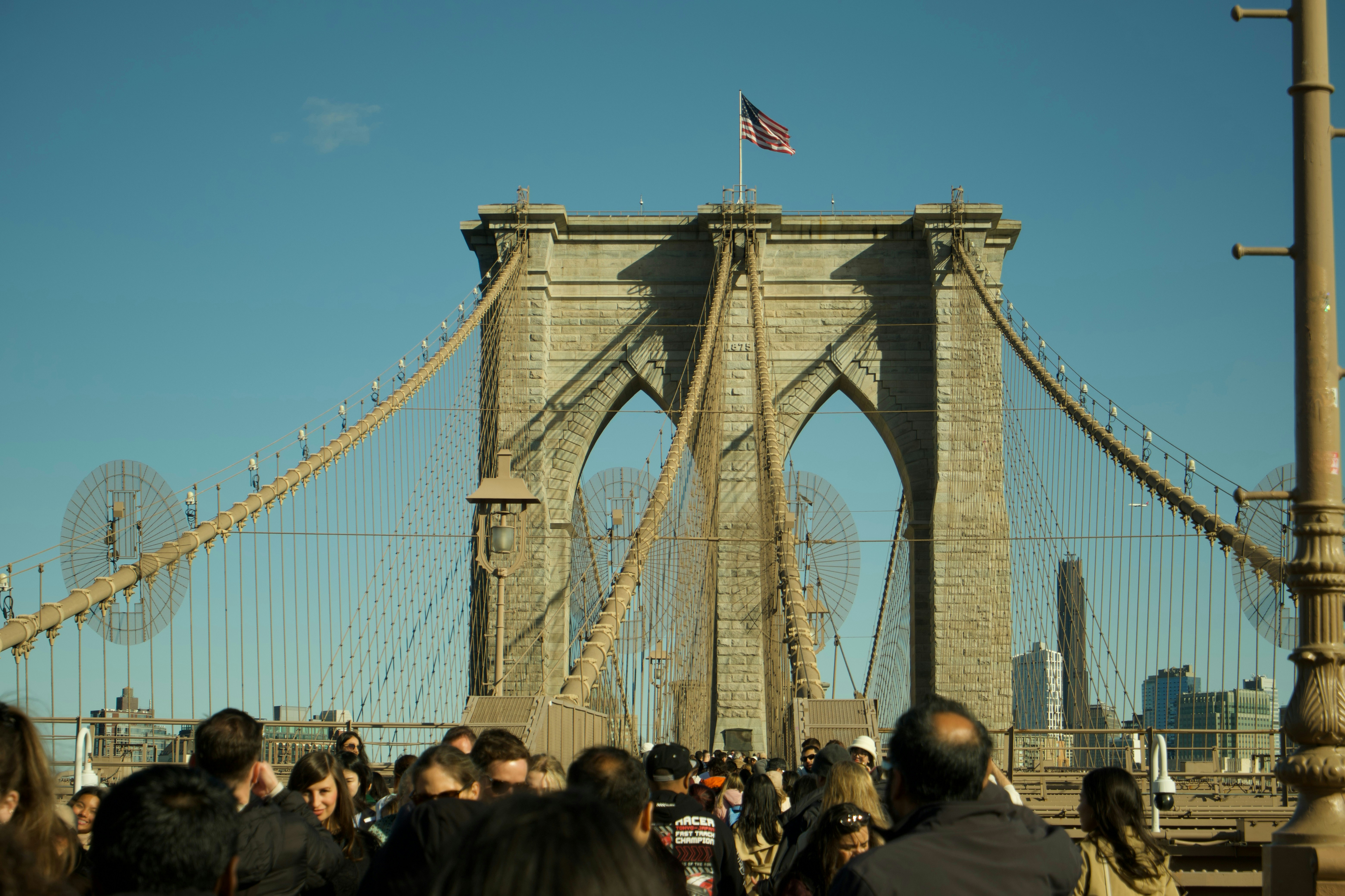 Bridge of People: A Sunny Walk Across a City Landmark