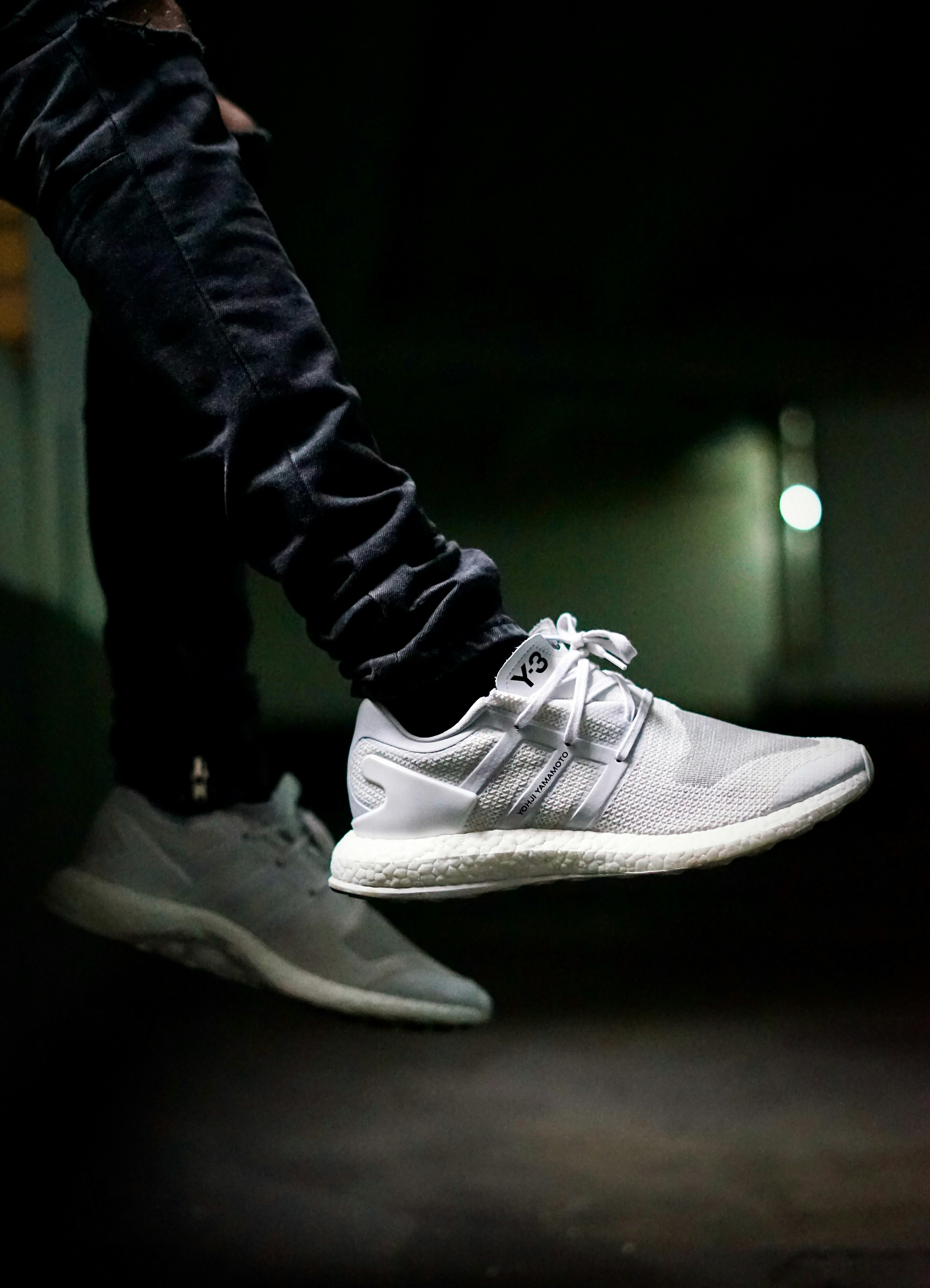 Mid-Air White: A Runner's Step in the Night