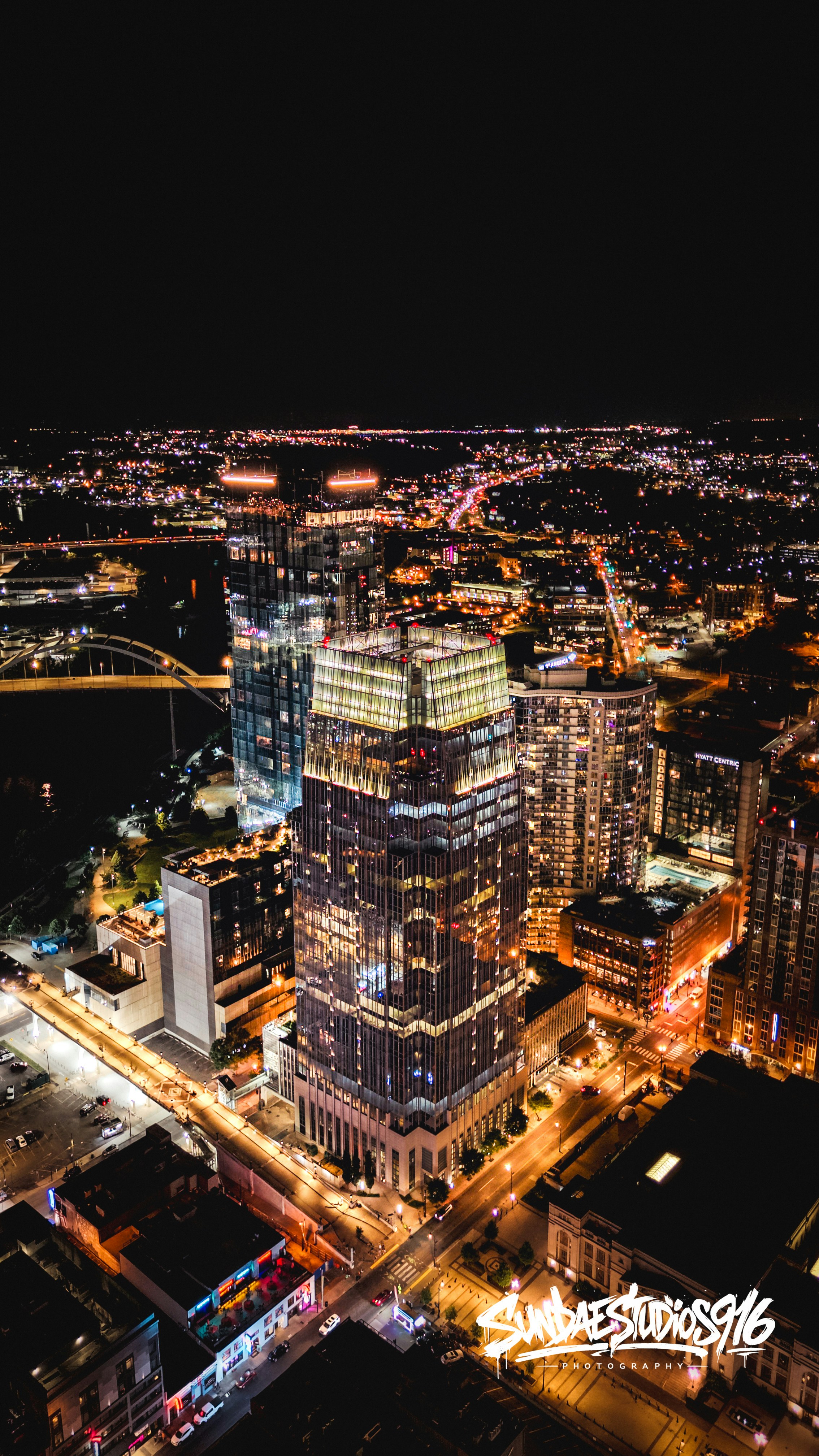 A Skyward Pulse: Neon Towers Loom Over Night-Scaled Grid