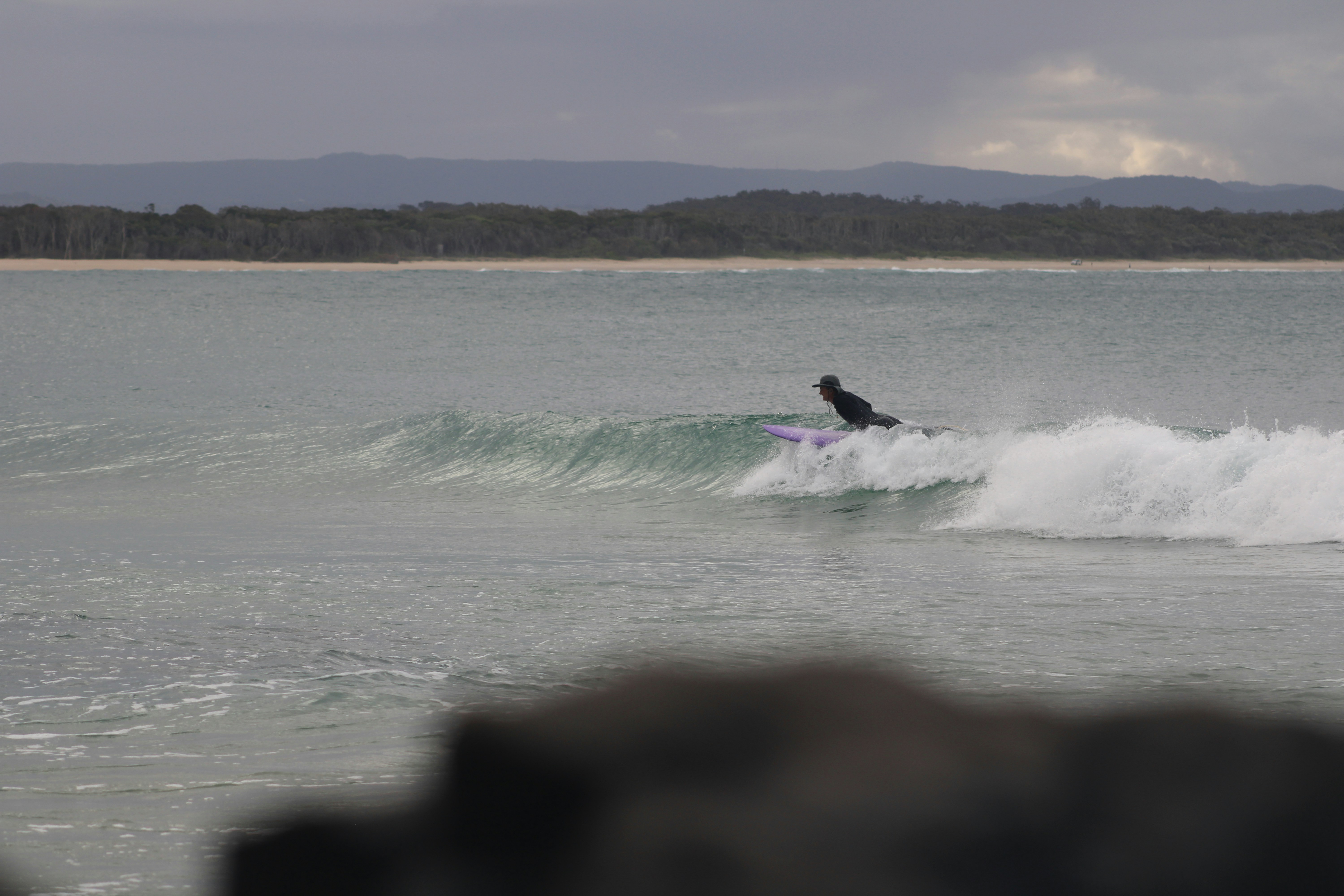 Surf Rider in a Distant Crest