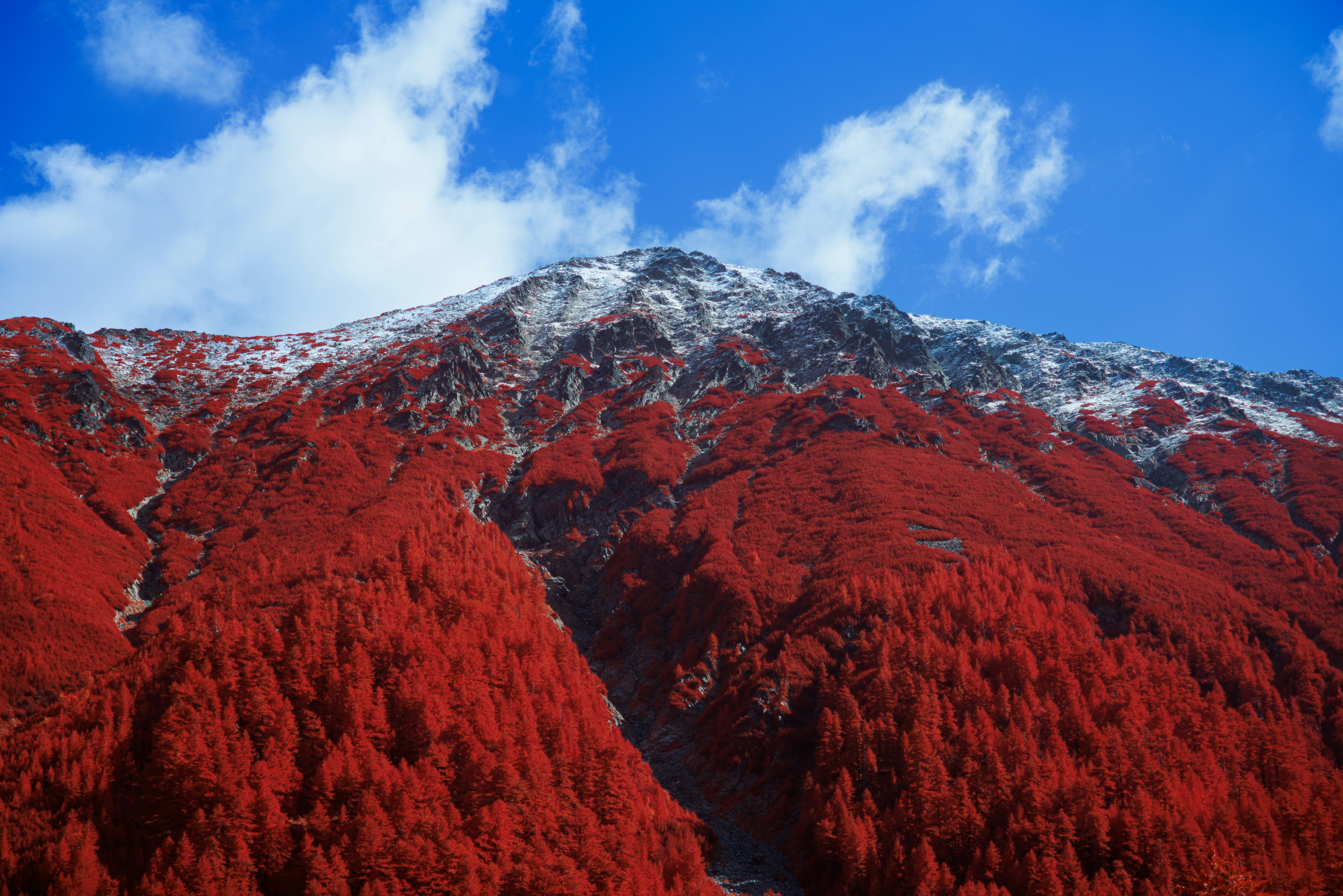 Crimson Mountains Under a Cerulean Sky
