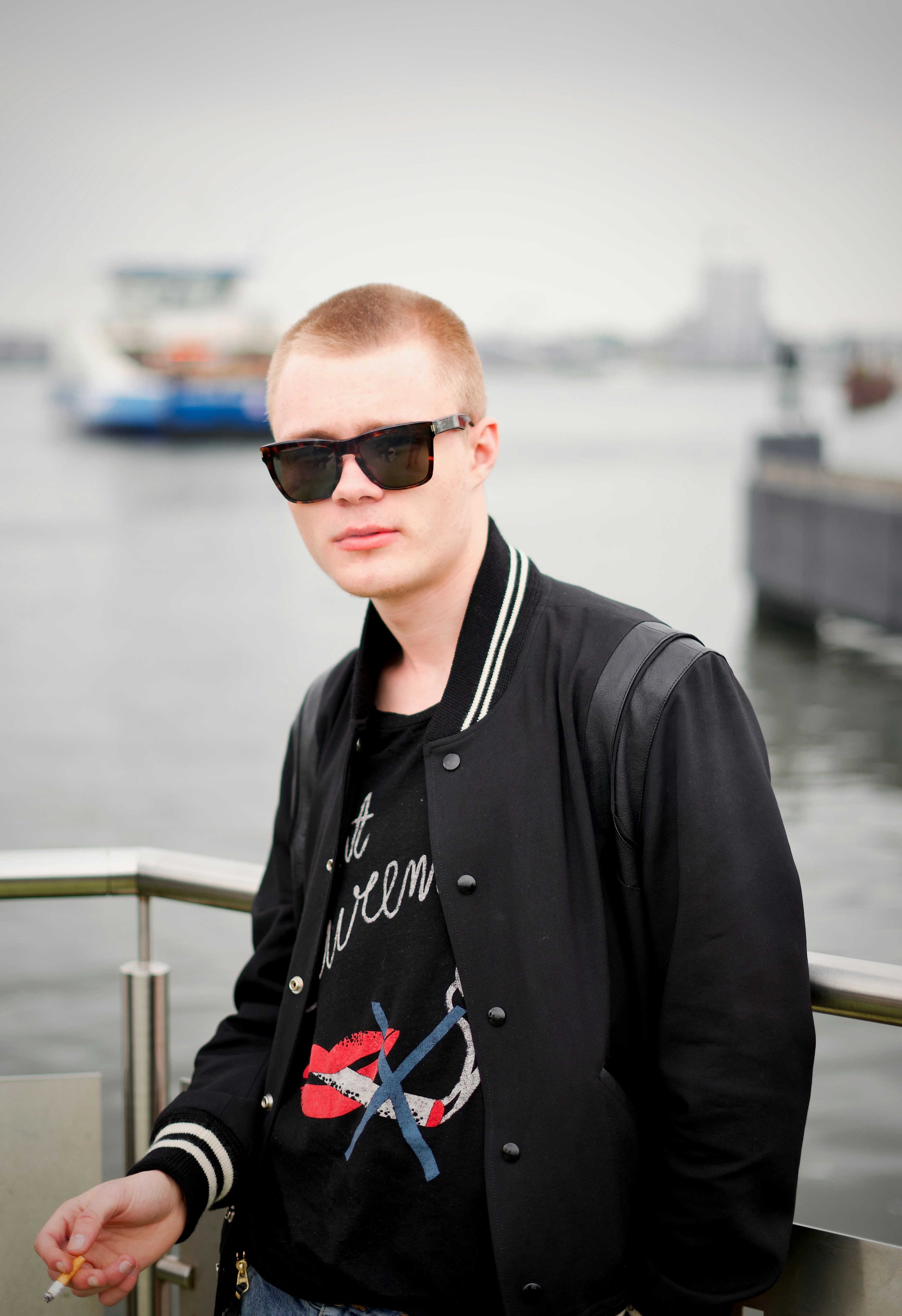 Urban Portrait in Soft Focus: A Bright-eyed Moment by the Waterfront