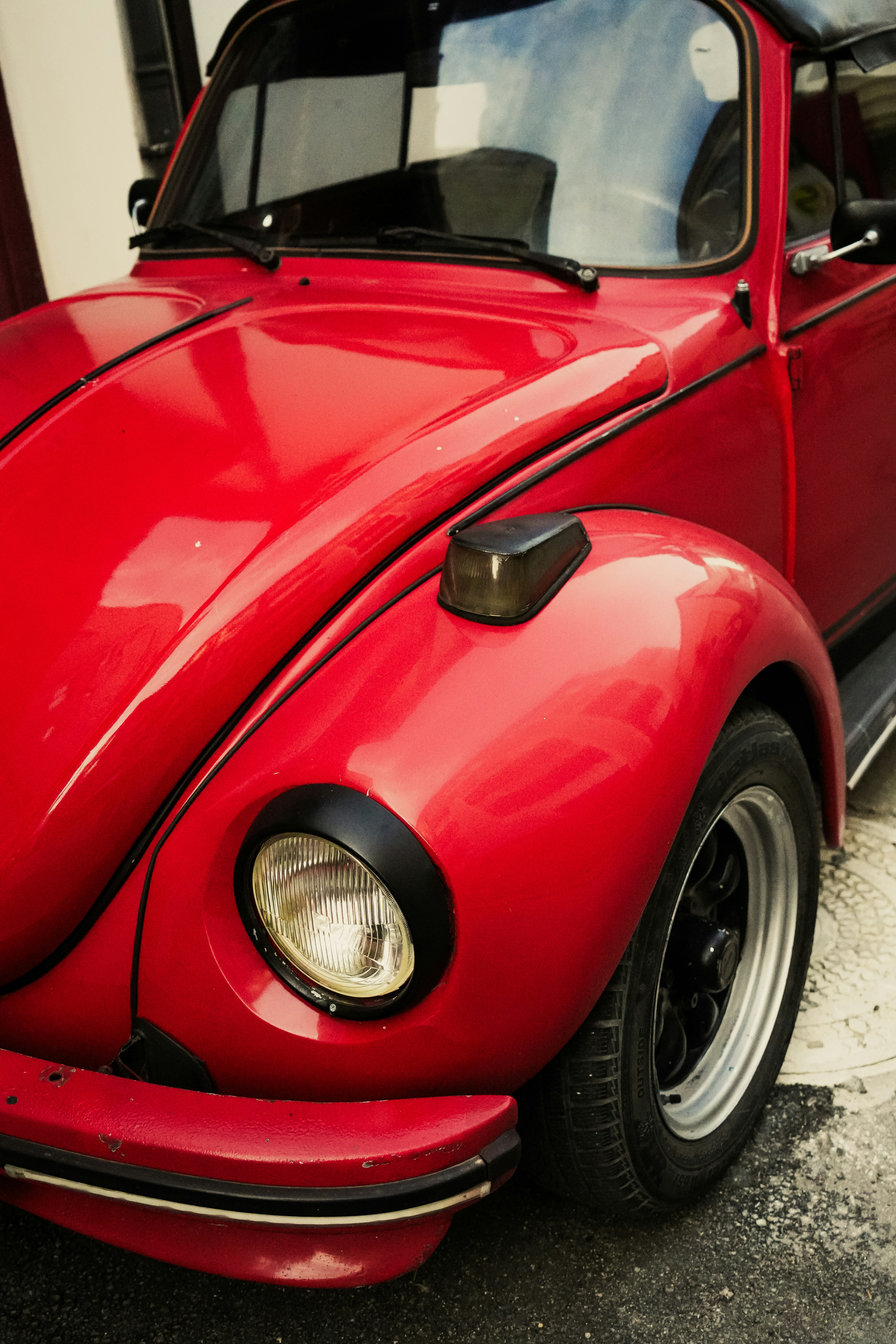 Crimson Curves: A Vintage Beetle’s Bold Front