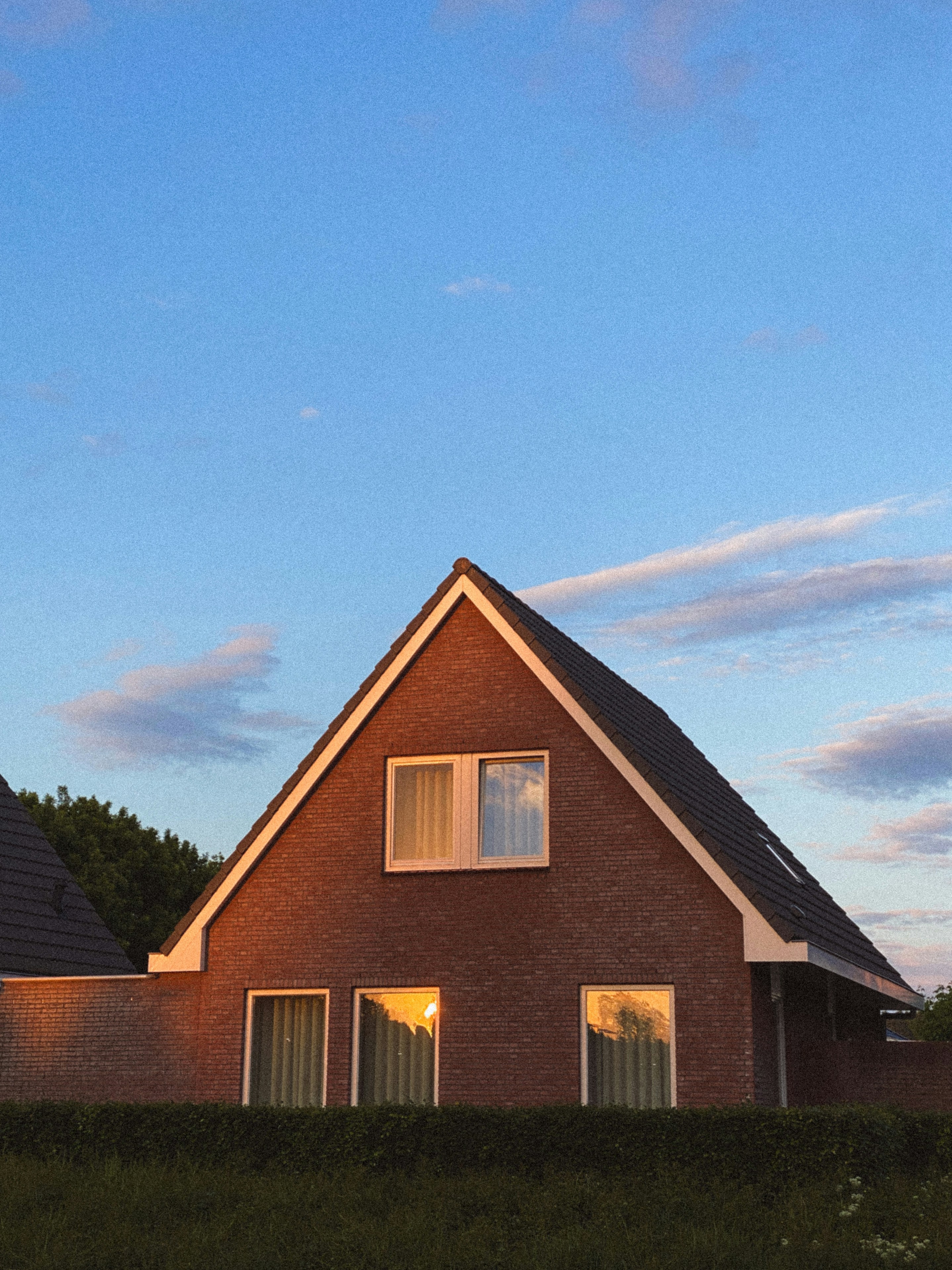 Triangle of Gable: Sunset Light on a Brick House