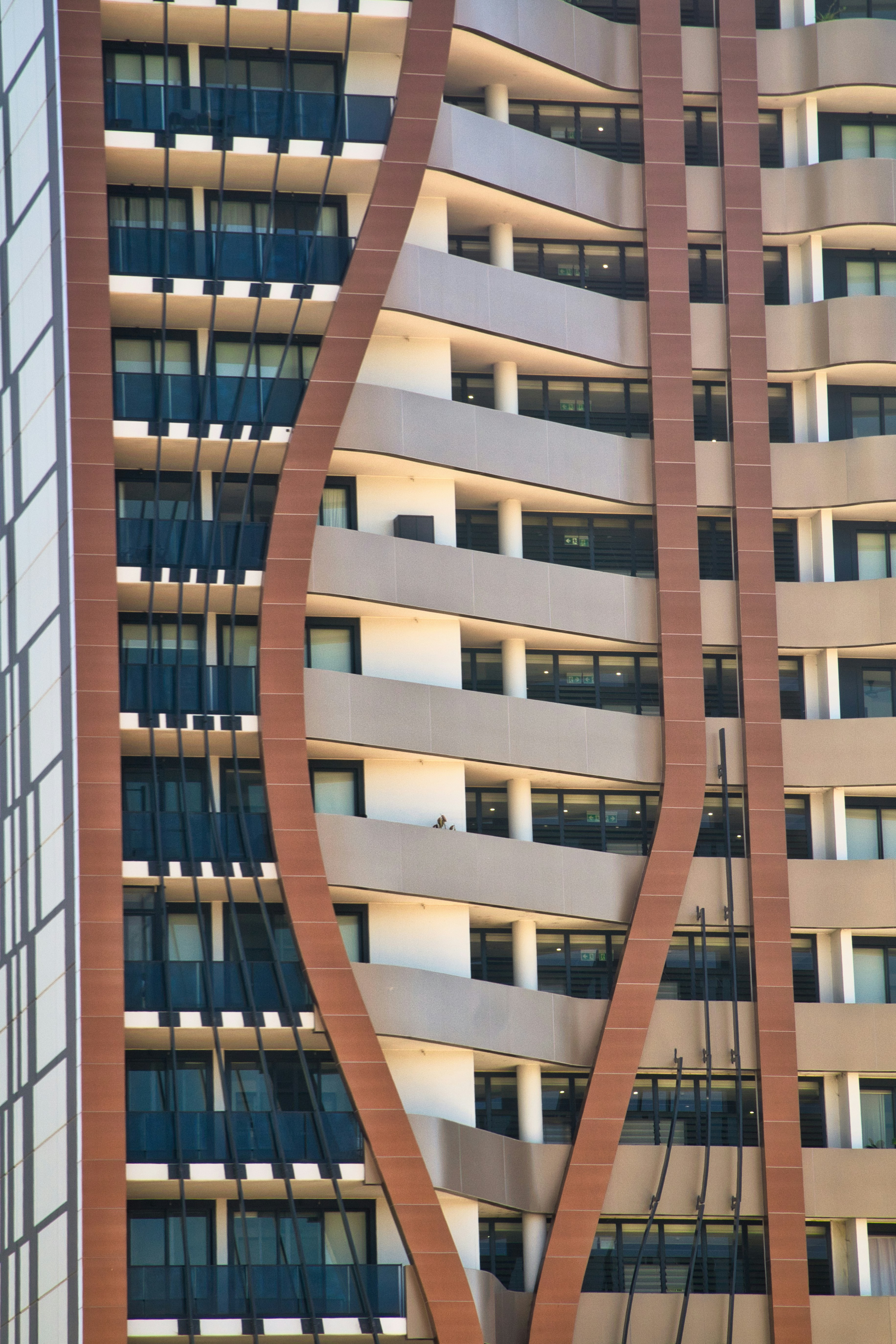 Curved Facade Confluence: A Modern Wave of Windows and Walls