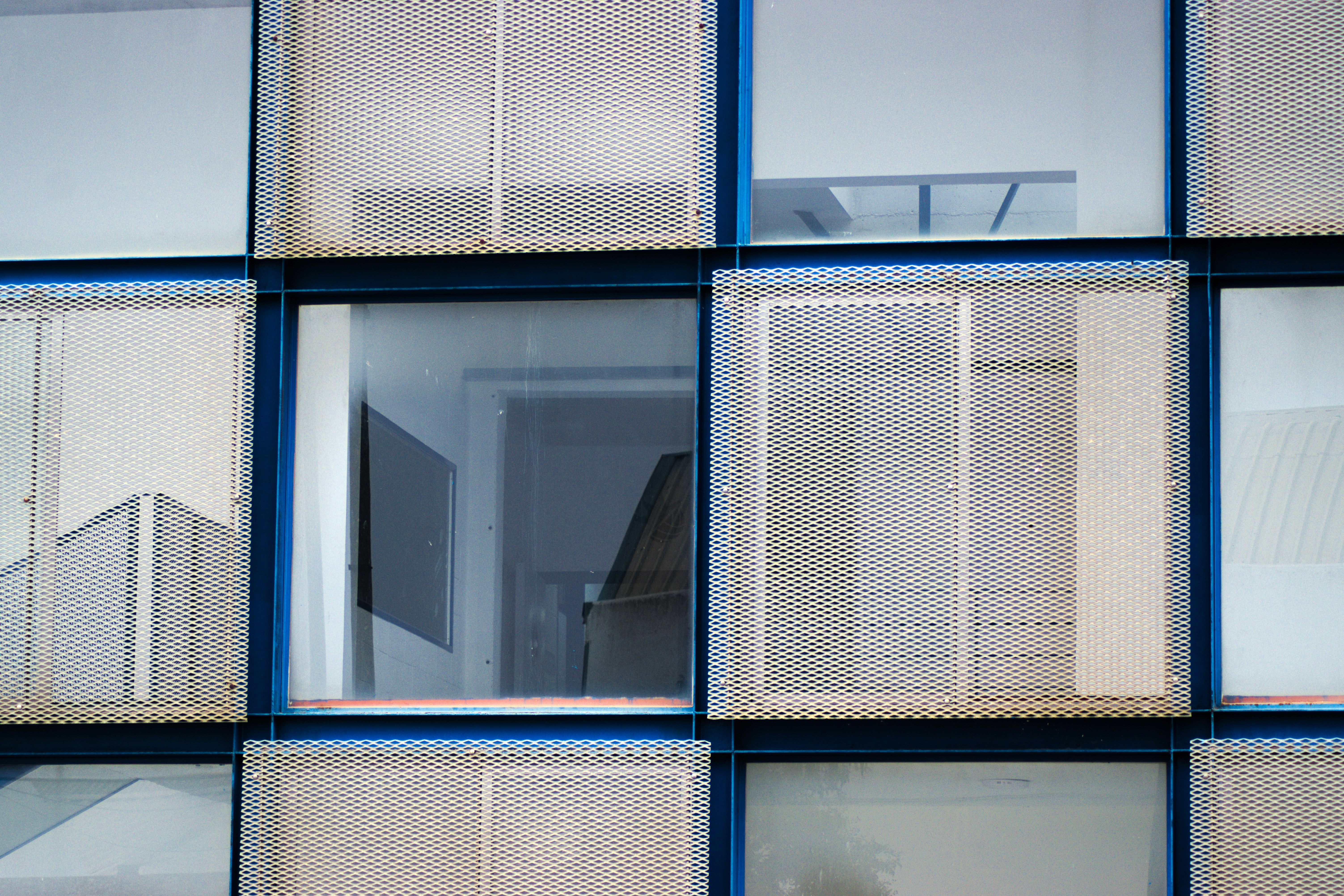 Hidden Window Grid: A Pattern of Perforated Facades