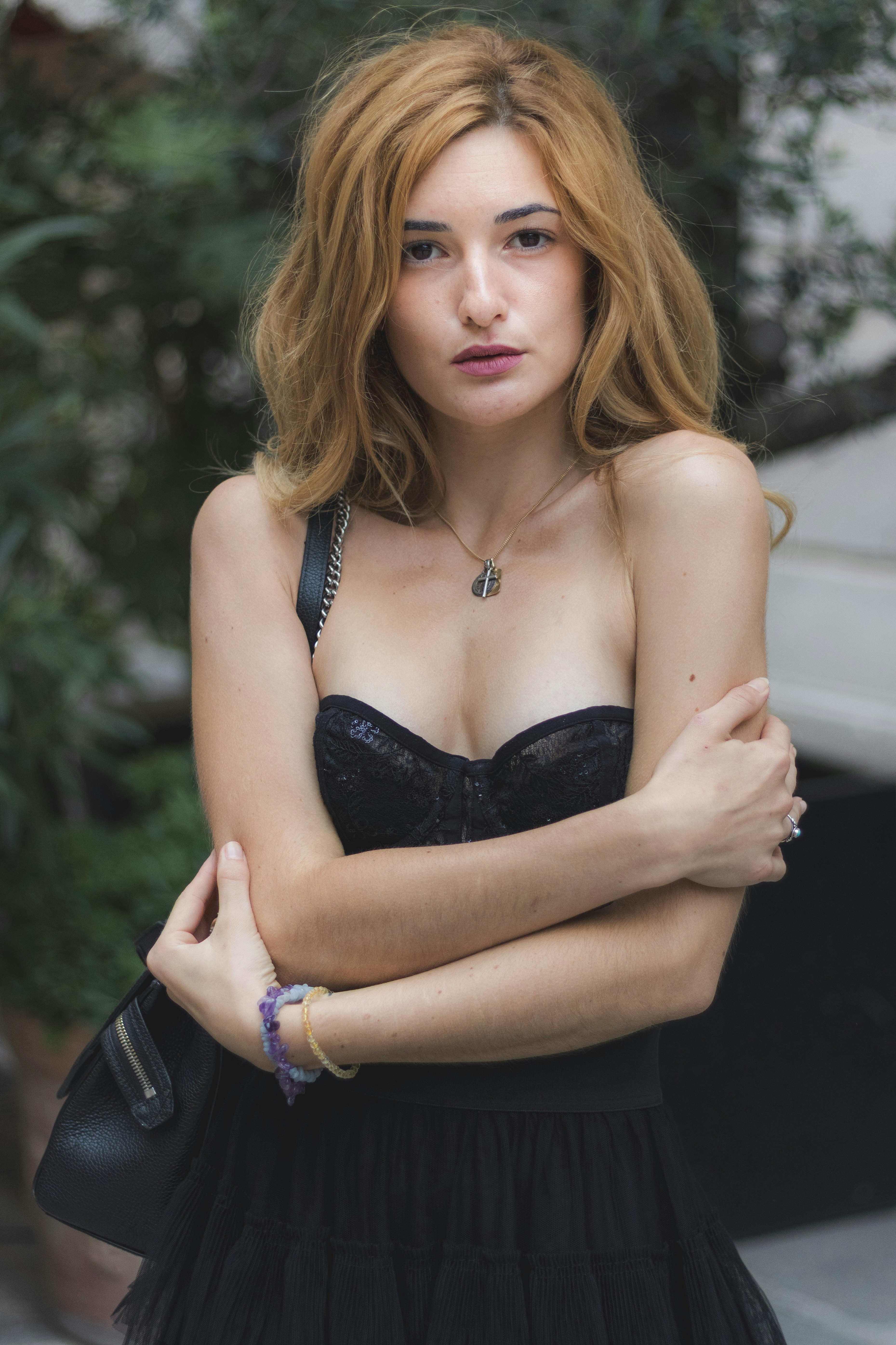 Soft-focus Portrait: confident gaze beneath sunlit copper hair