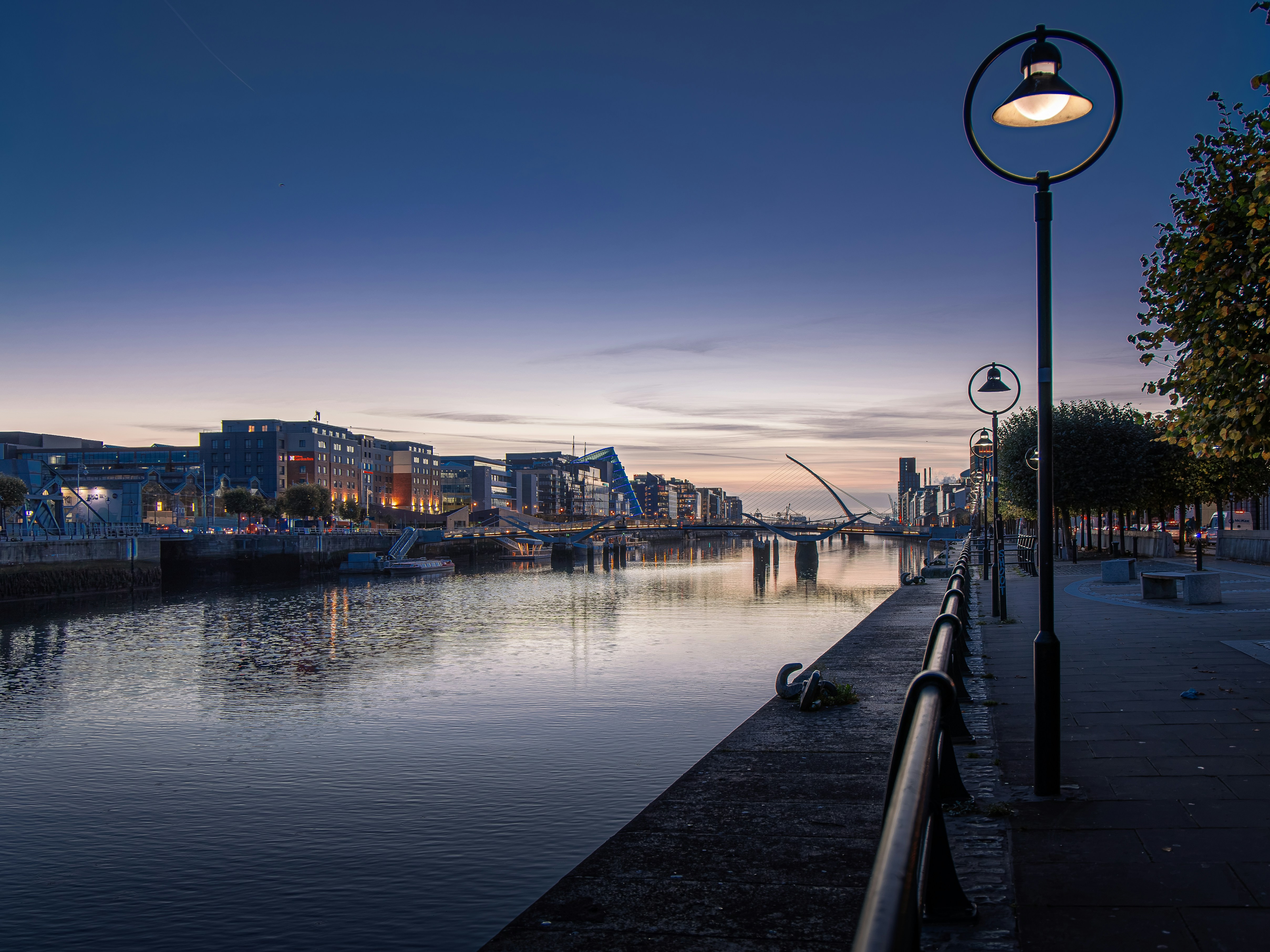 Quiet Dockside Evening: Lamps, Reflections, and Horizon