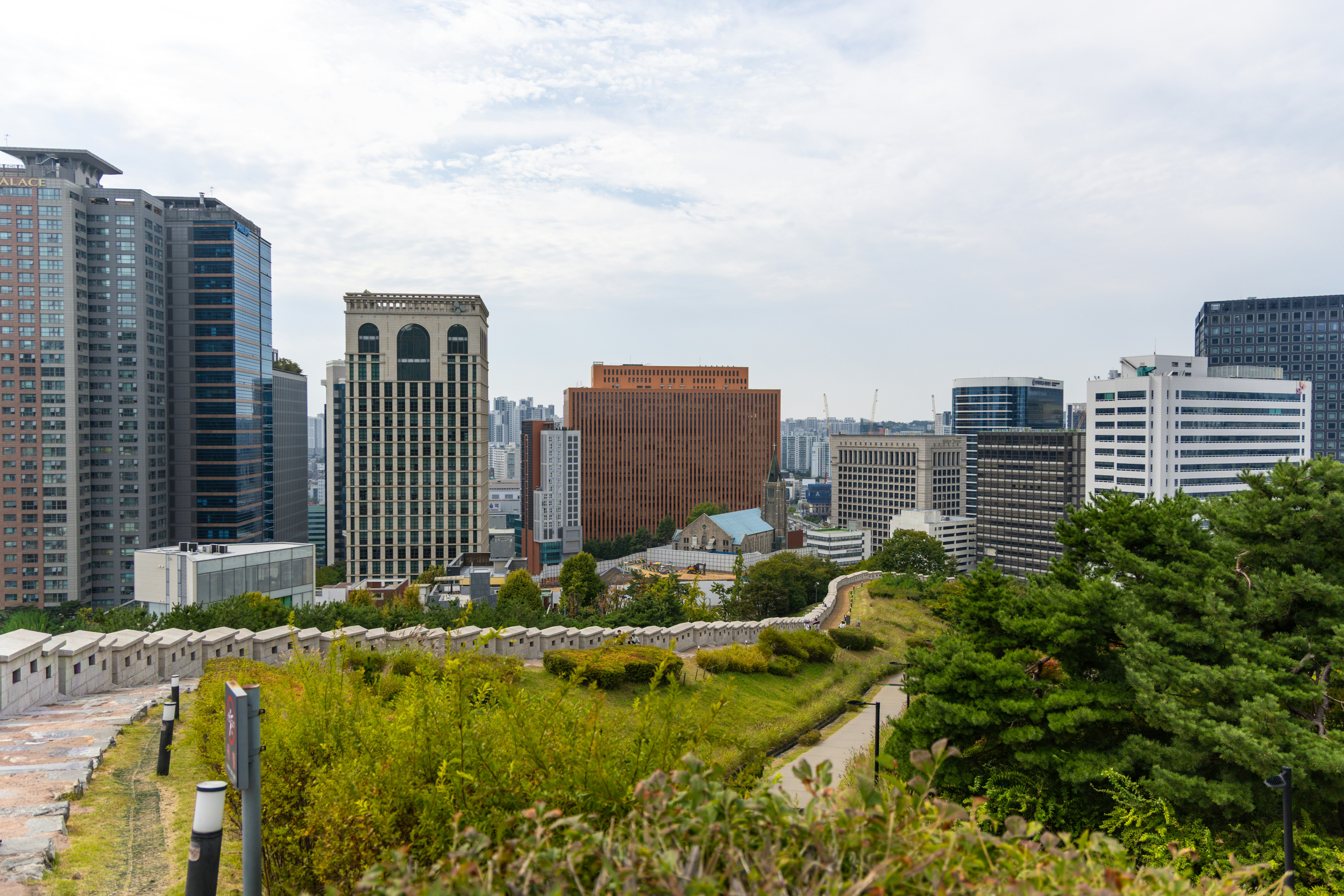 Urban Crest: City Skyline Emerges Beyond the Historic Fort Garden