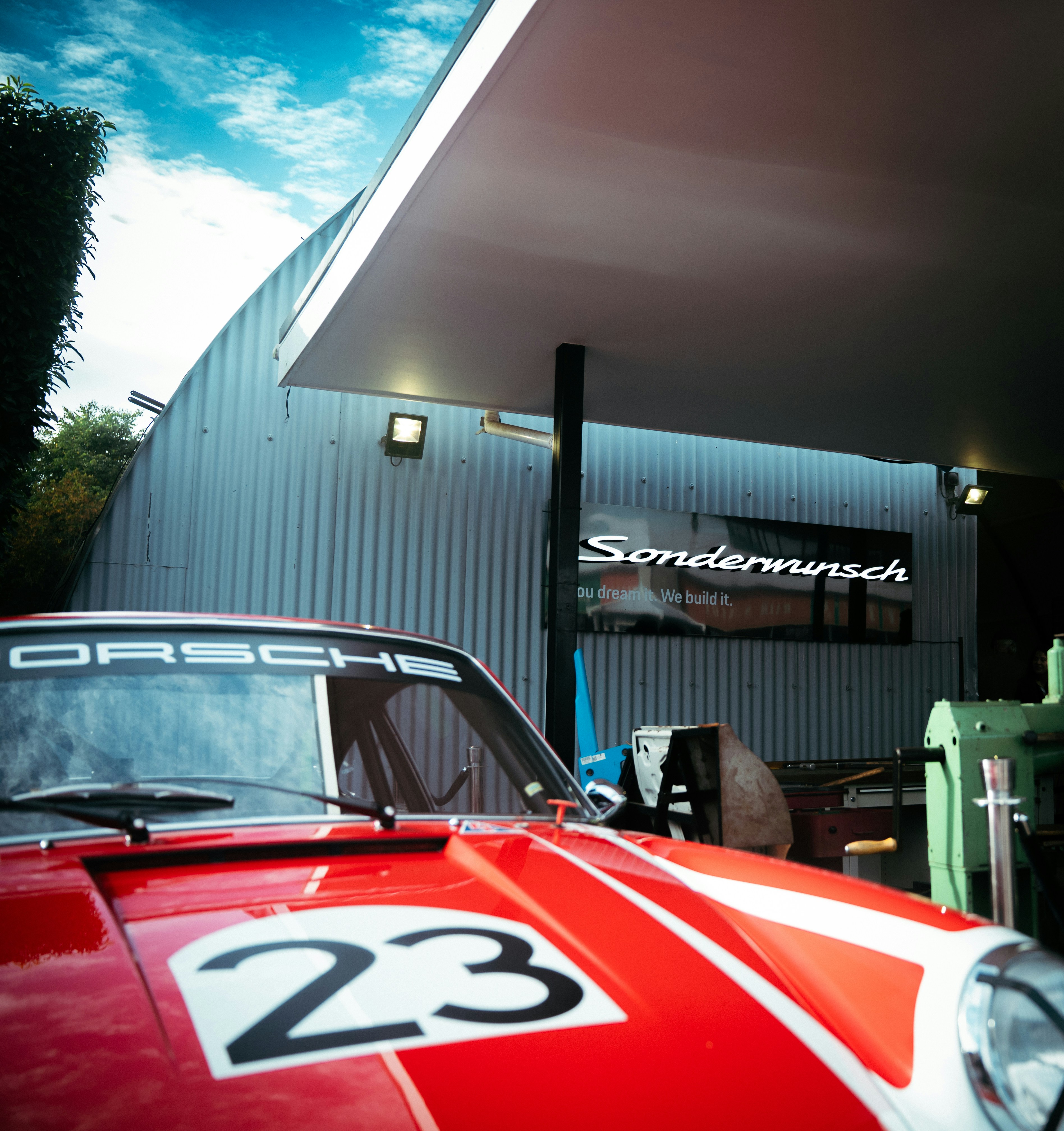 Racing Power Under the Canopy: A Red Porsche Snaps into Focus