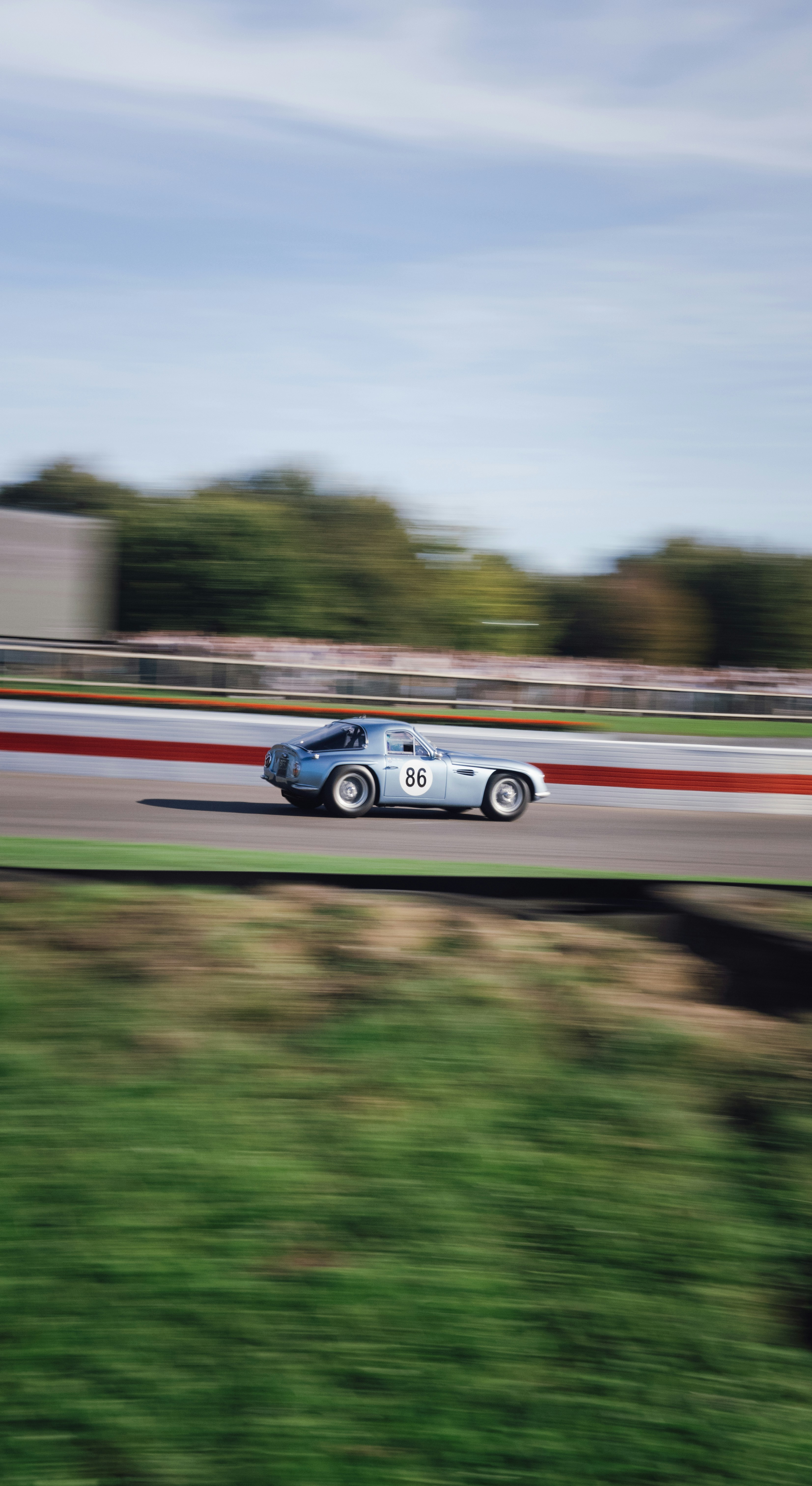 Classic Silver Racer in a Blur of Speed