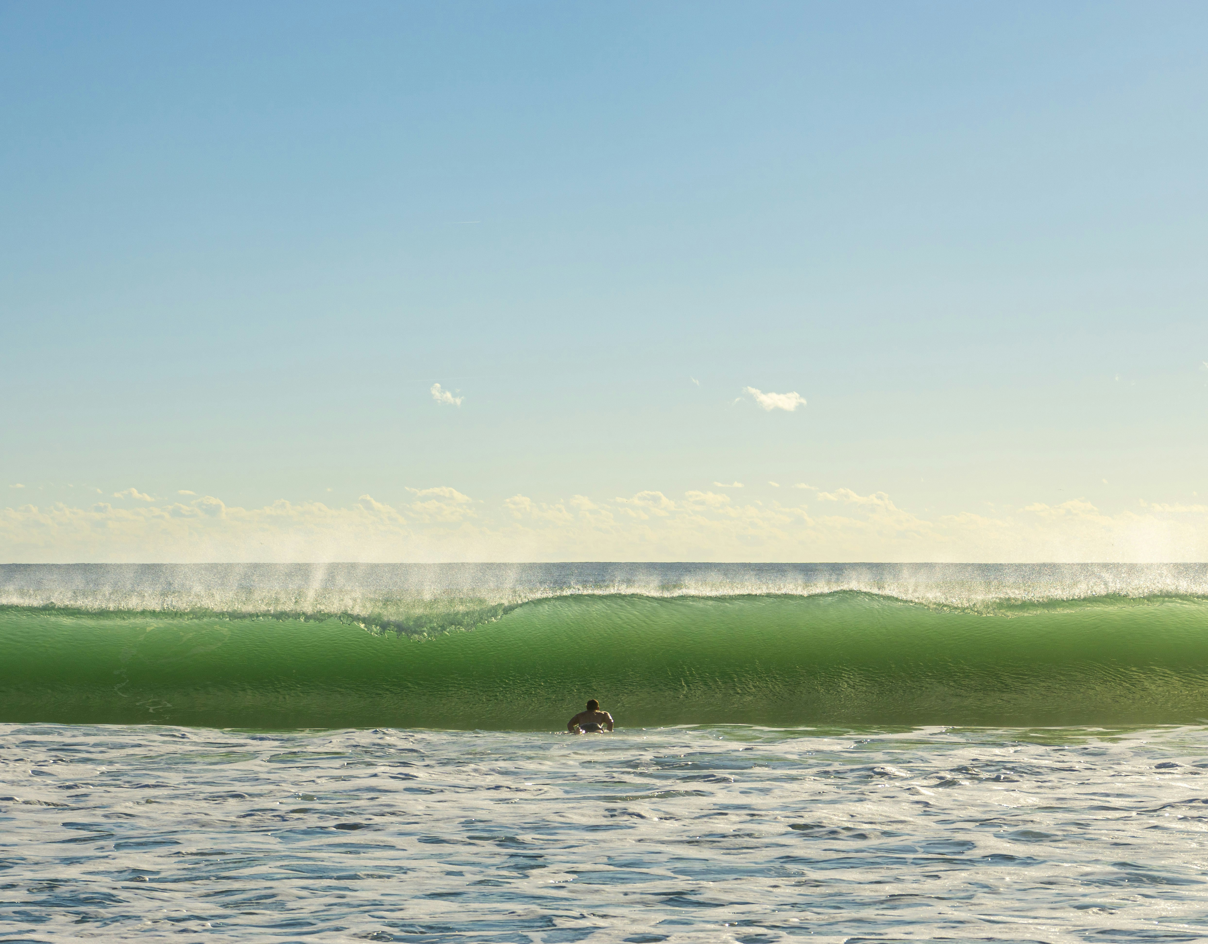 Green Giant Break: Surfer in a Lip of Peak Wave at Sunset Sea