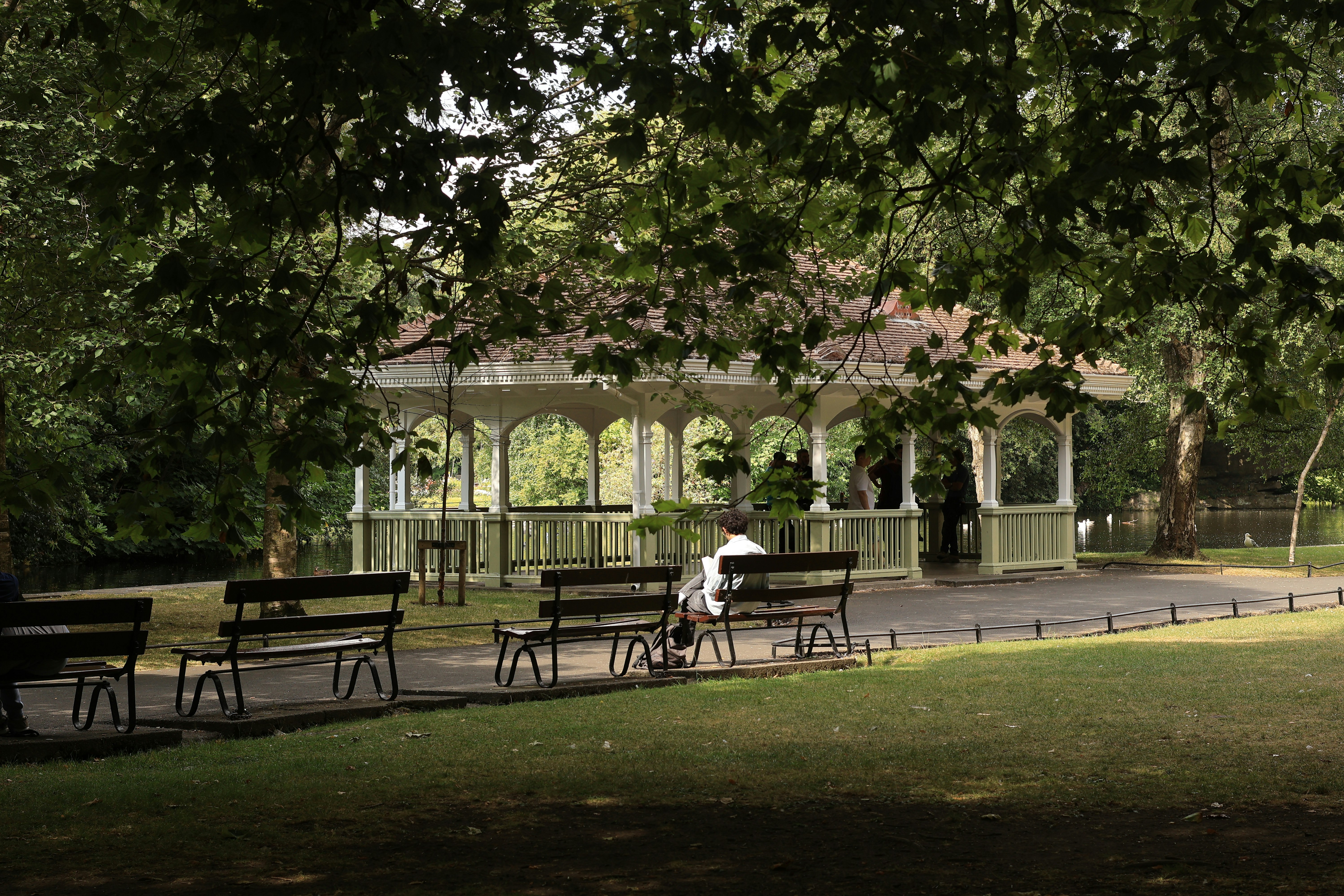 Quiet Park Pavilion: A lone reader on the library-green