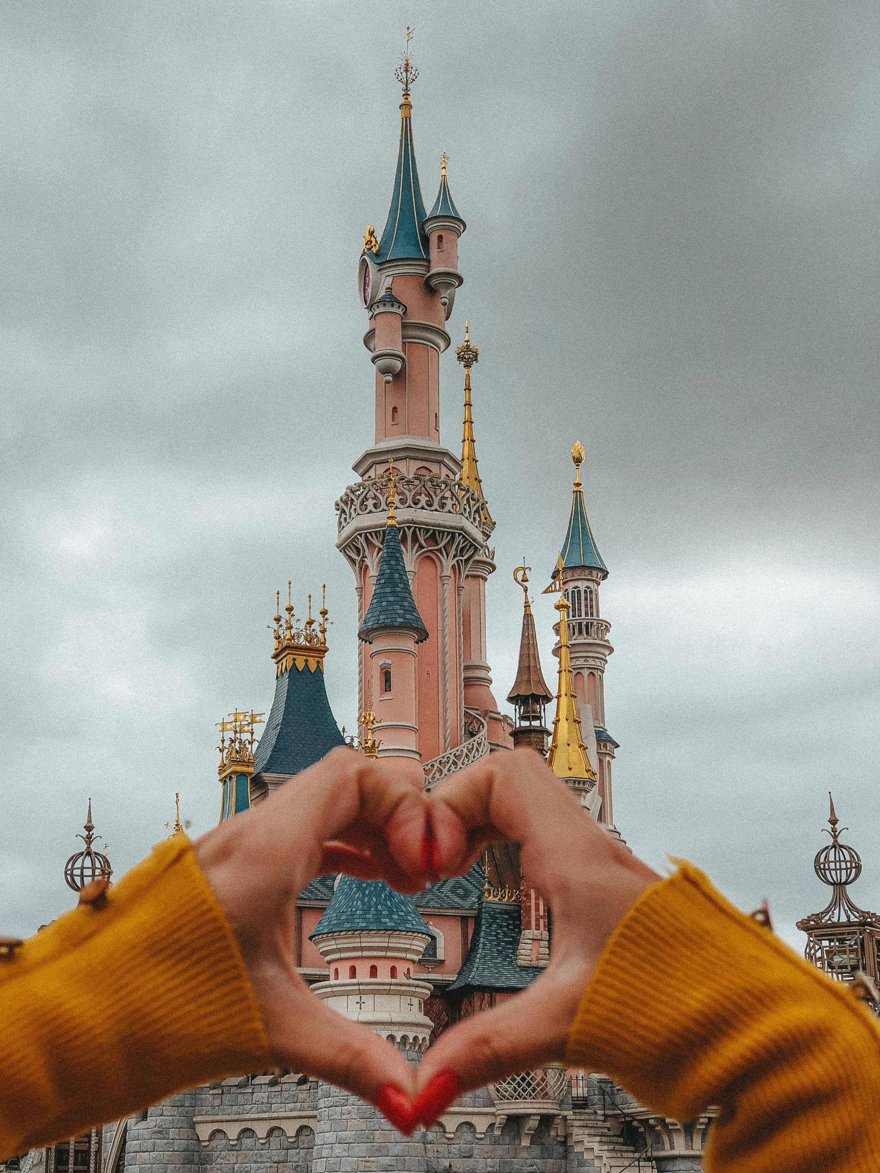 Castle Heart: Hands Form a Heart Frame Around the Towers
