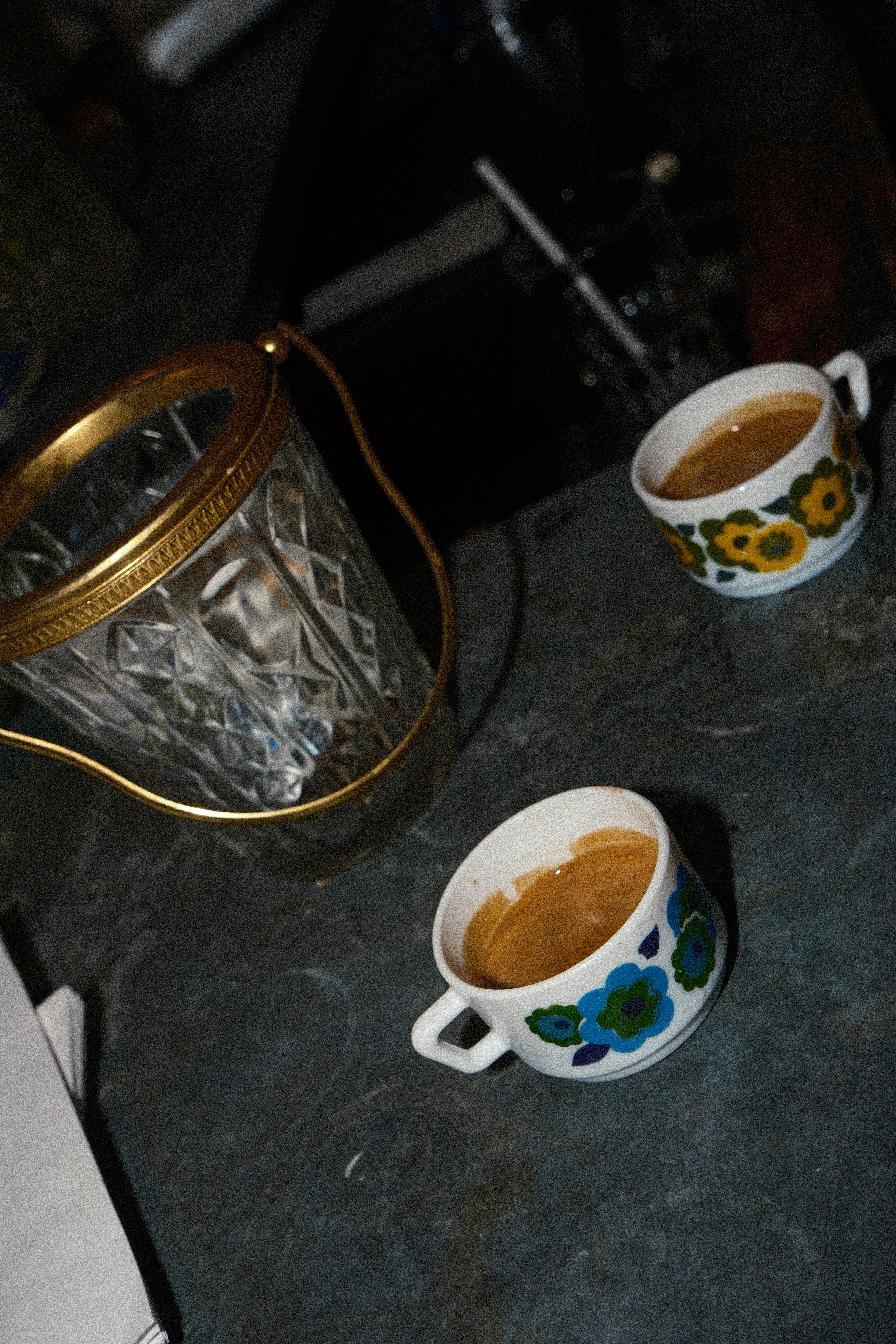 Tea Time in a Dim Studio: Cups on a Weathered Table