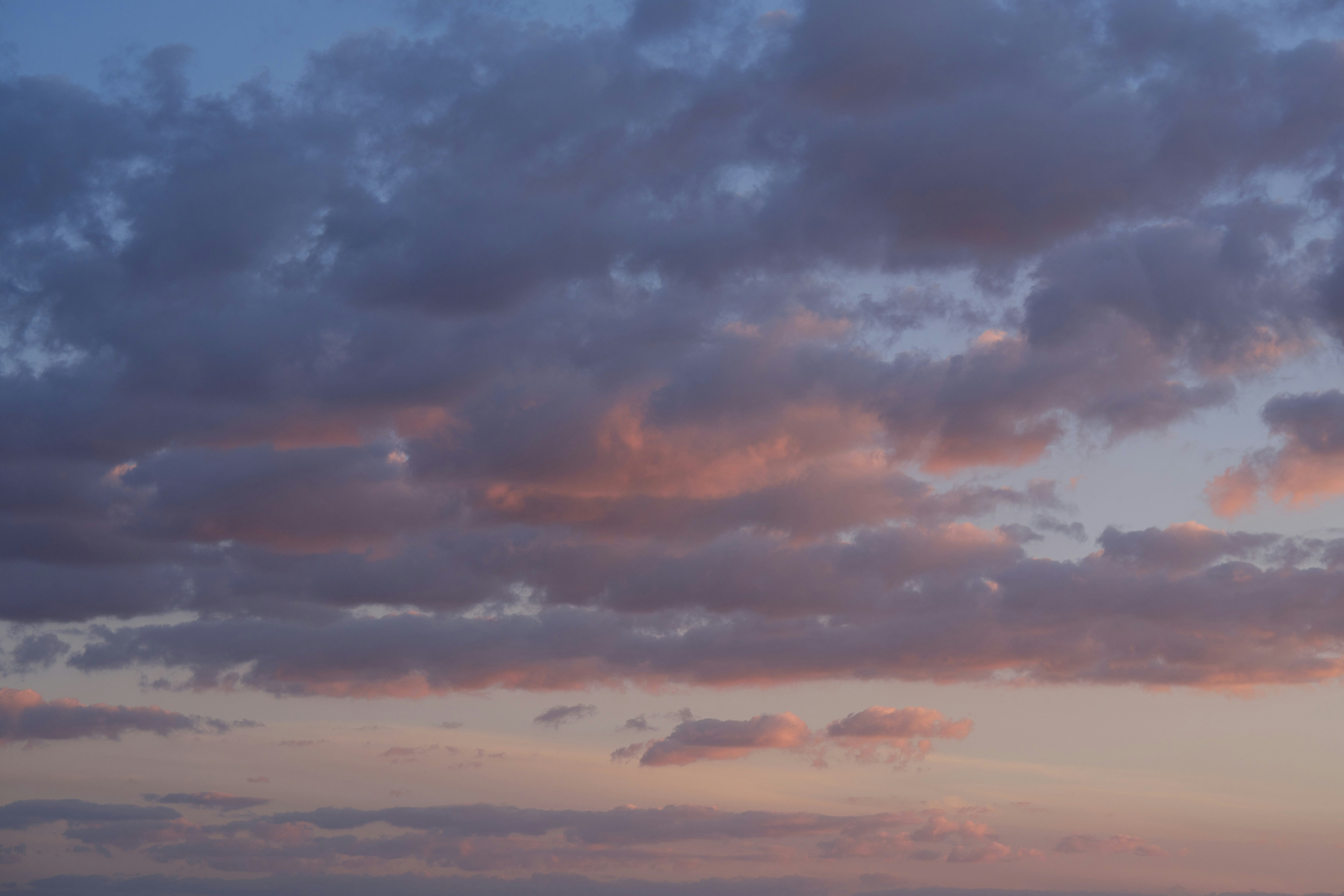 Soft Horizon Choir: Sunset Clouds Over Quiet Ocean Sky