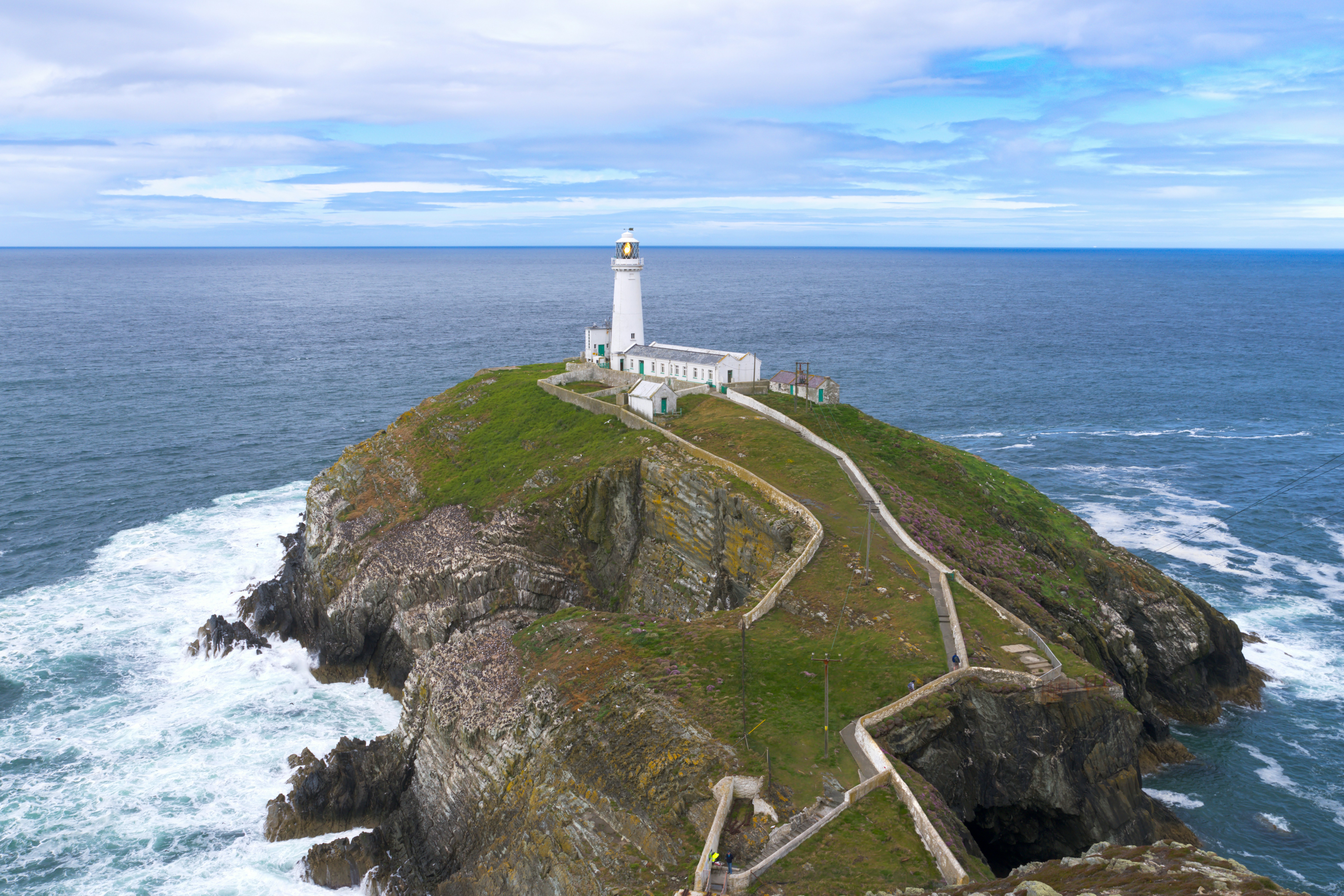 Lighthouse Sentinel: A Coastal Climb to the White Tower