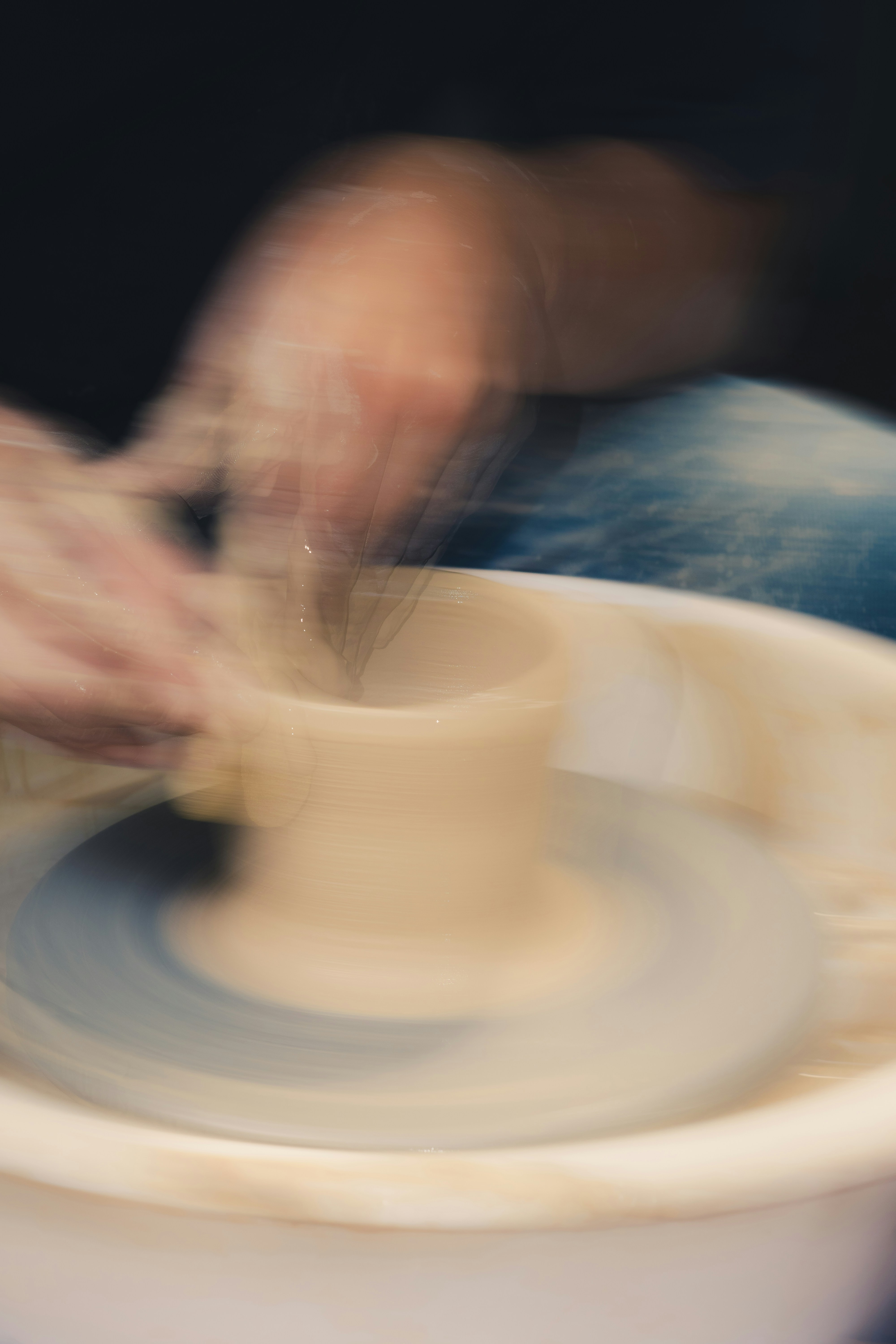 Blurry Hand-Turned Pottery on a Spinning Wheel