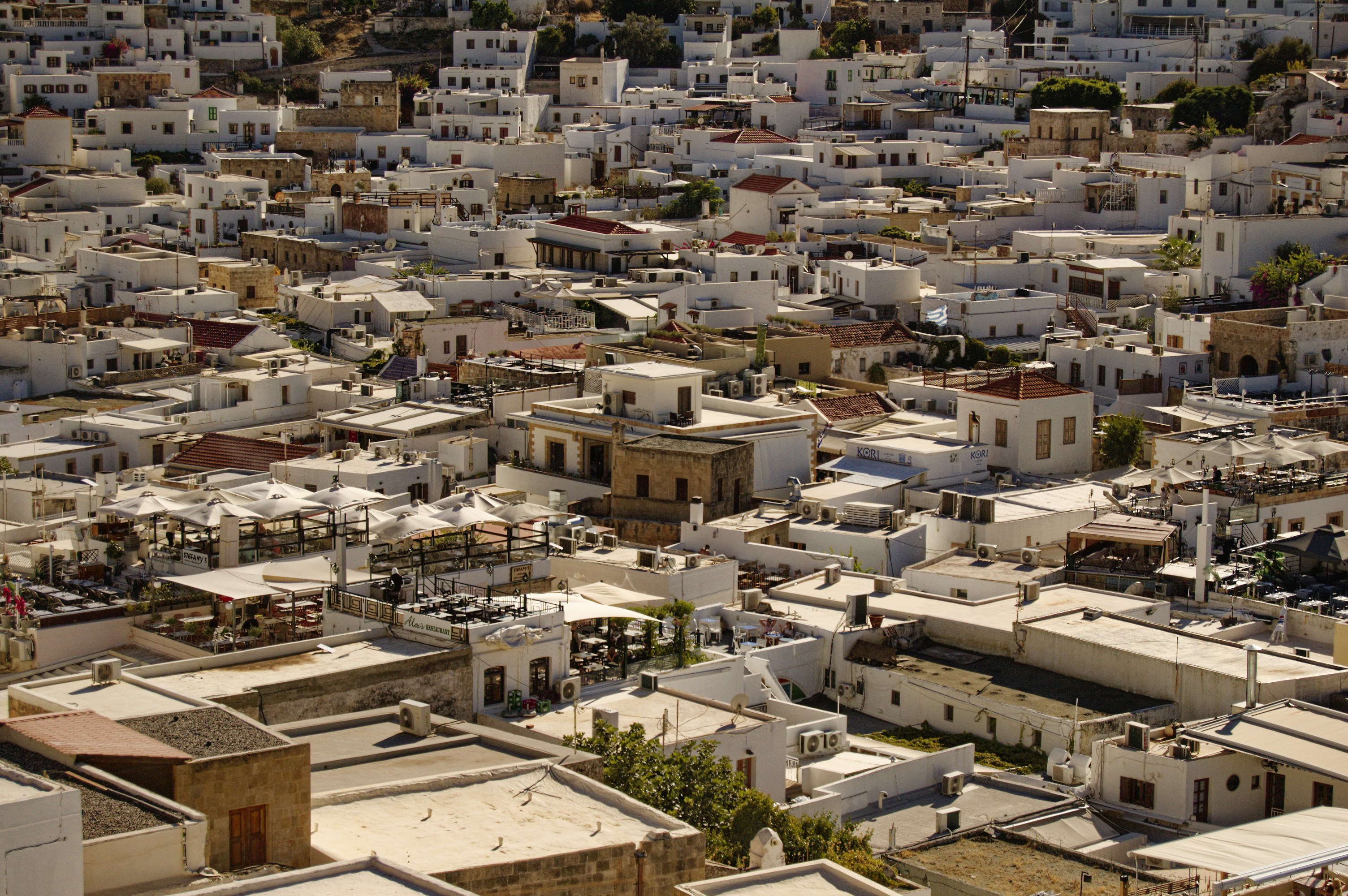 Ariadne's White Maze: Sunlit Rooftops Stacked in a Mediterranean Quarter