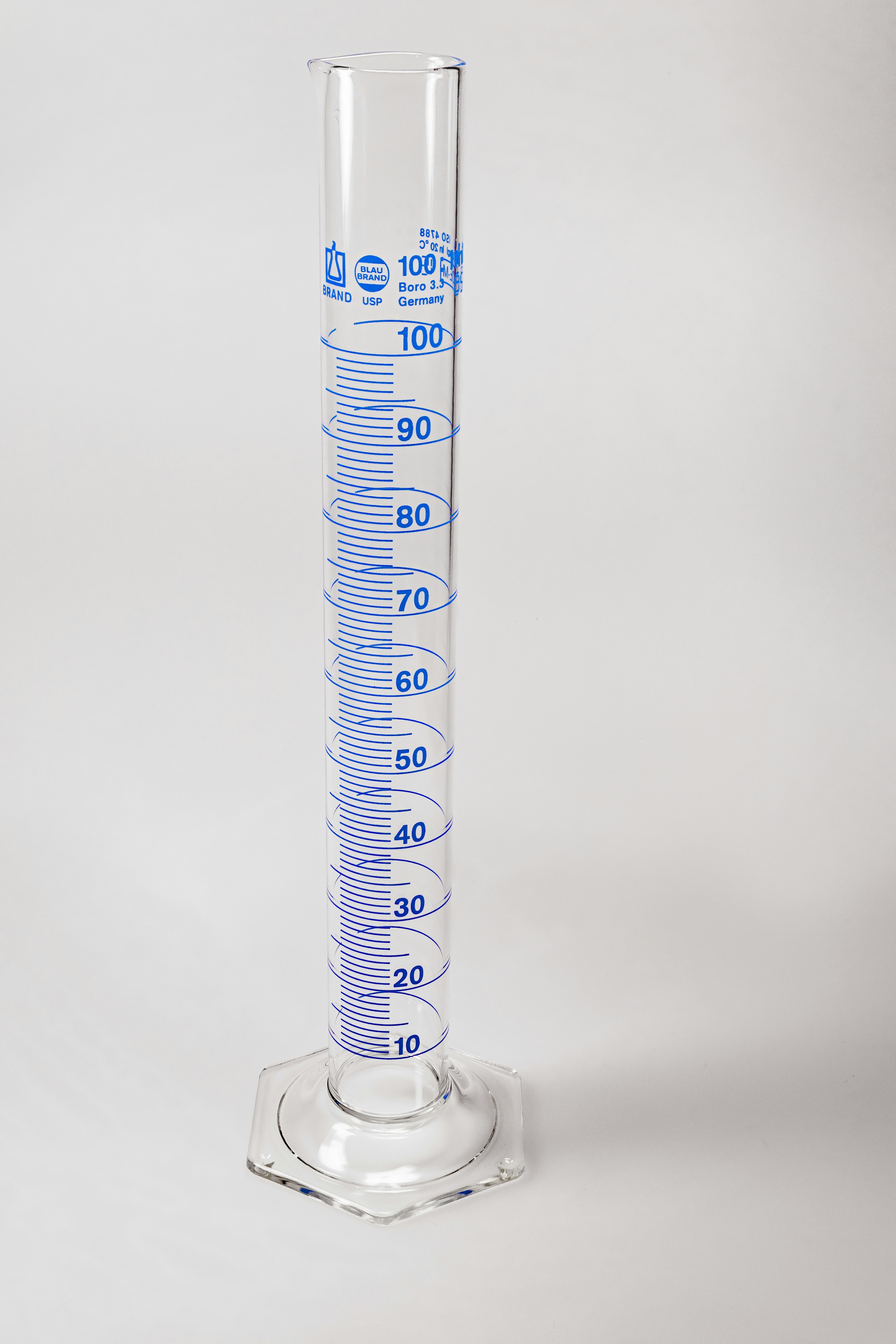 Graduated Precision: A Glass Graduates to 100 ml Mark