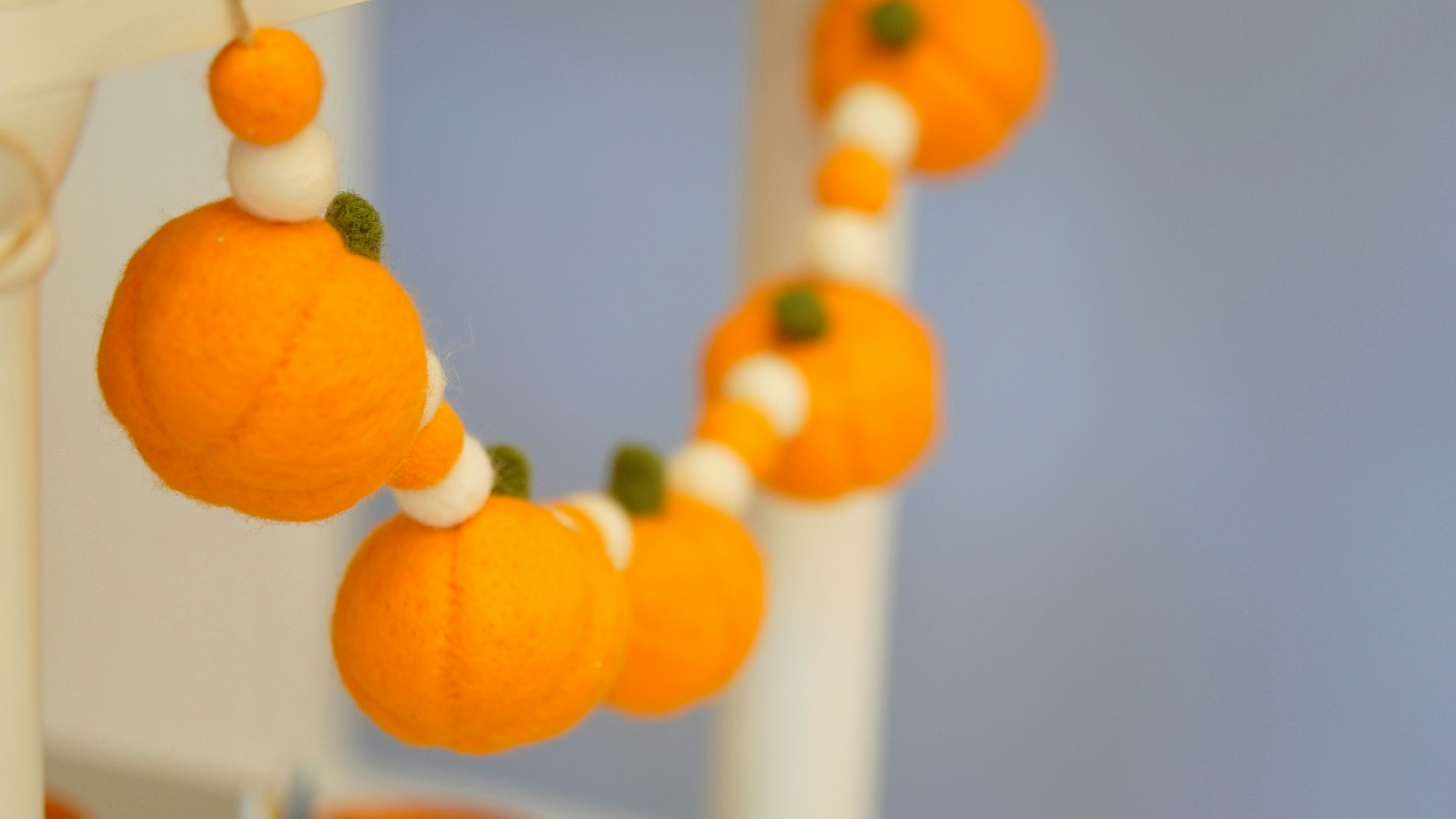 Orange Pumpkin Garland: A Soft-Focused String of Festive Orbs
