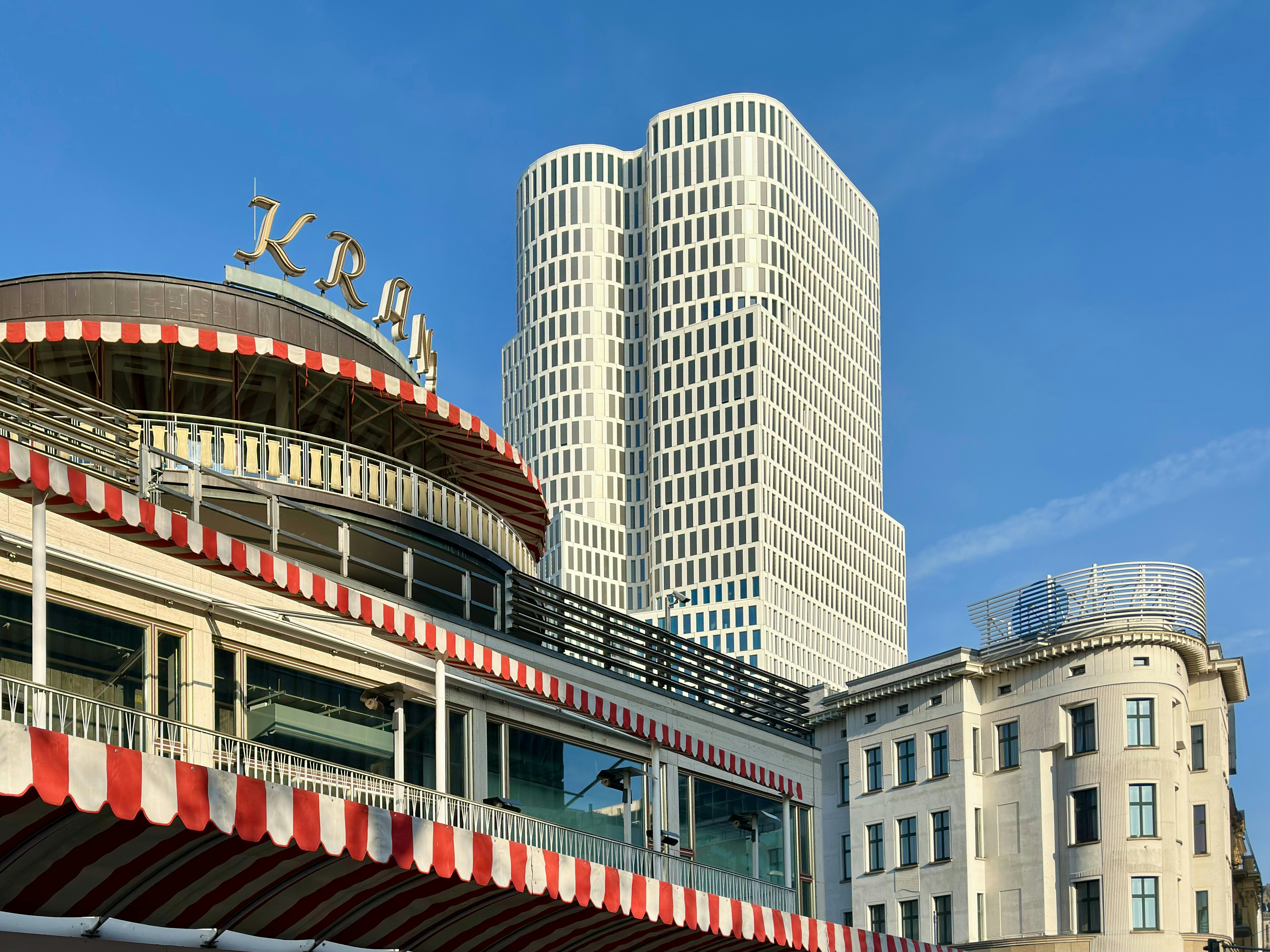 Red-and-White Terrace Meets Glass Towers