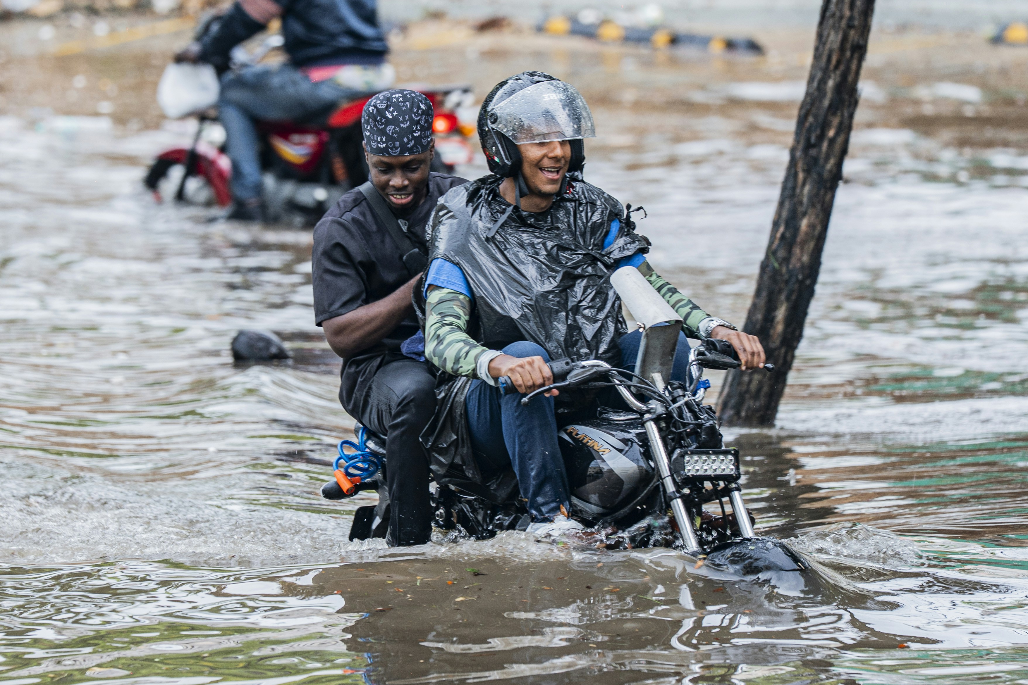 Riders in a Flooded Street: Shared Resilience on a Muddy Voyage