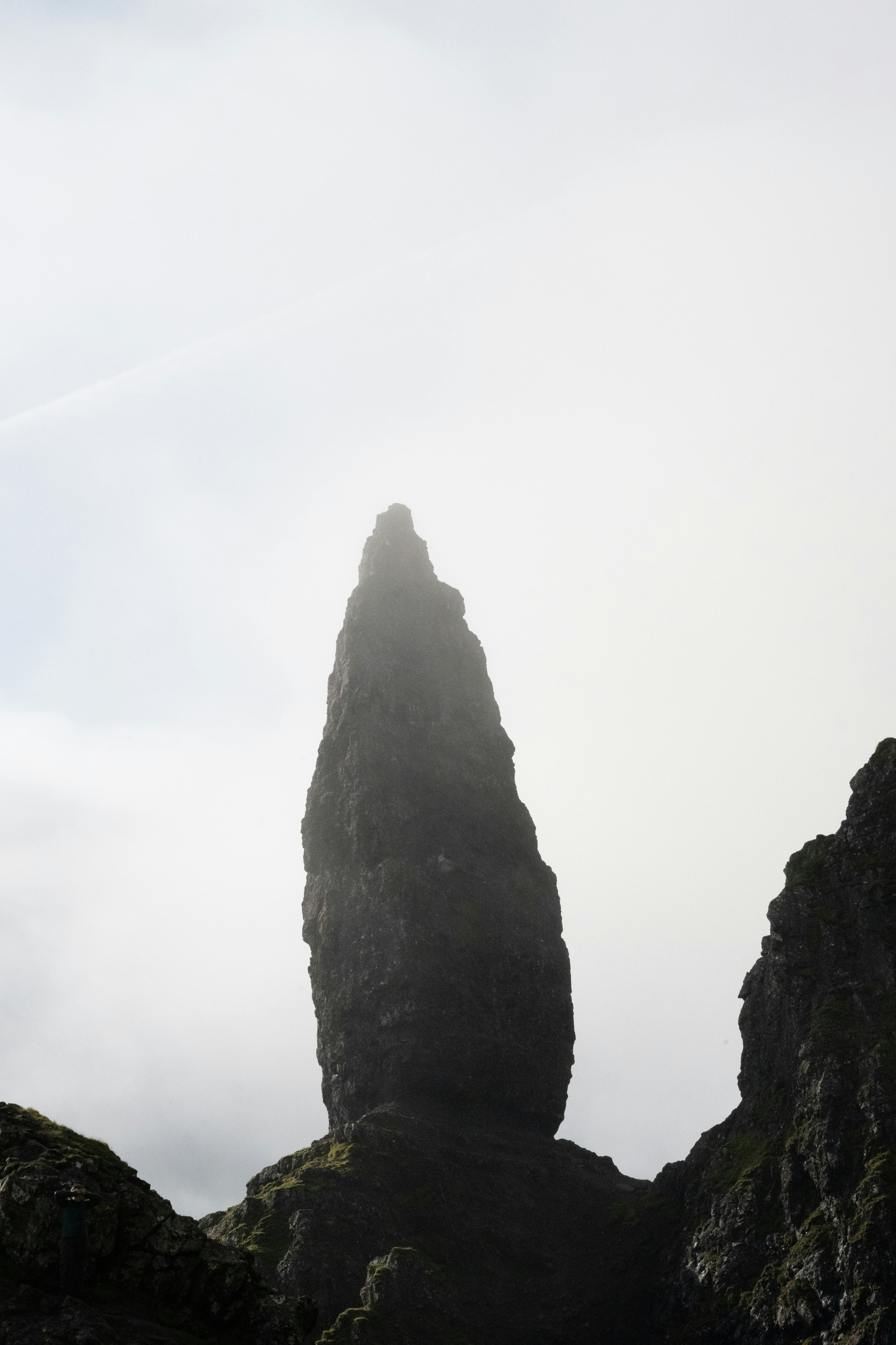 Monolithic Peak Piercing a Veiled Sky