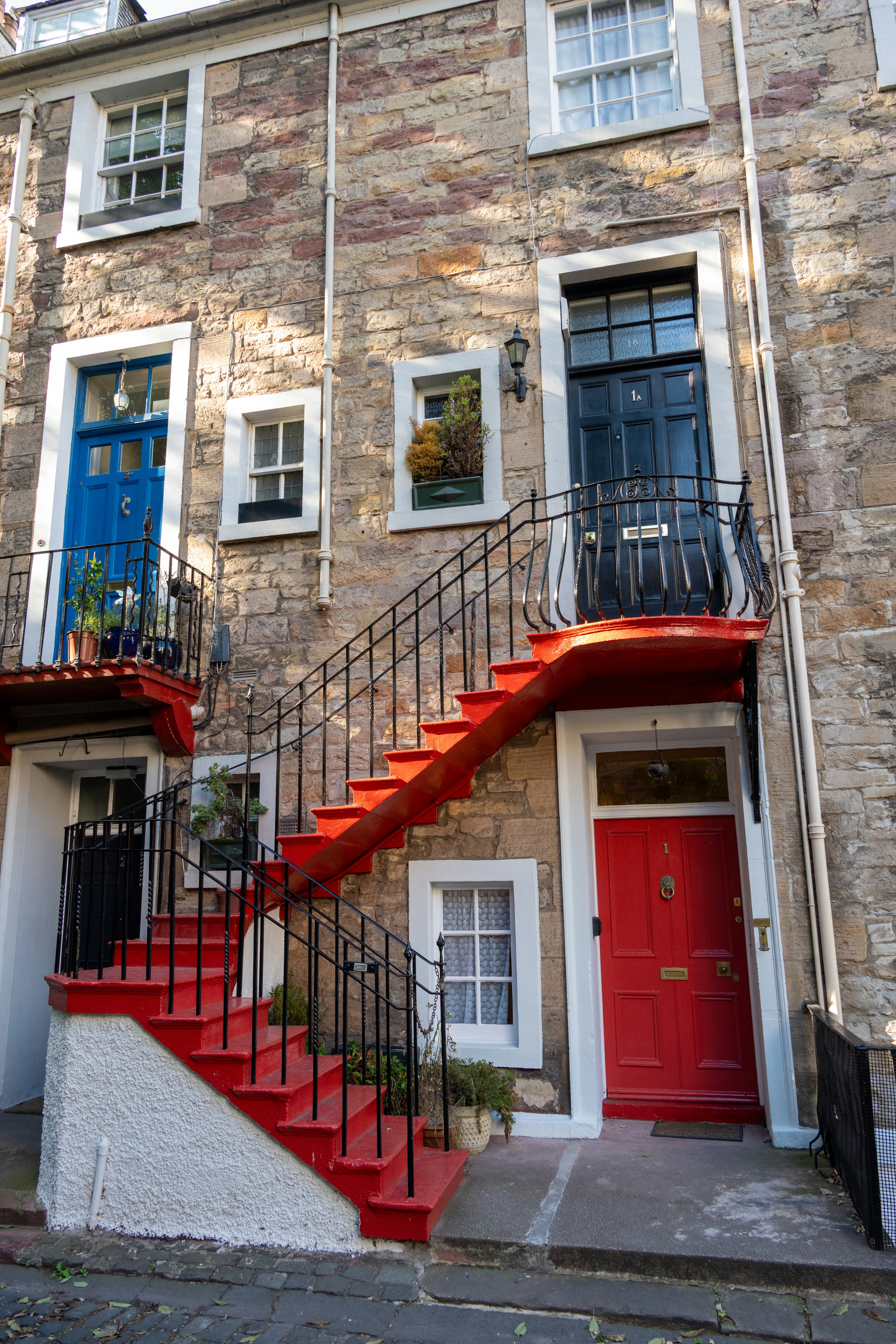 Crimson Staircase to the Blue Door: A Georgian Street, Sunlit and Sturdy