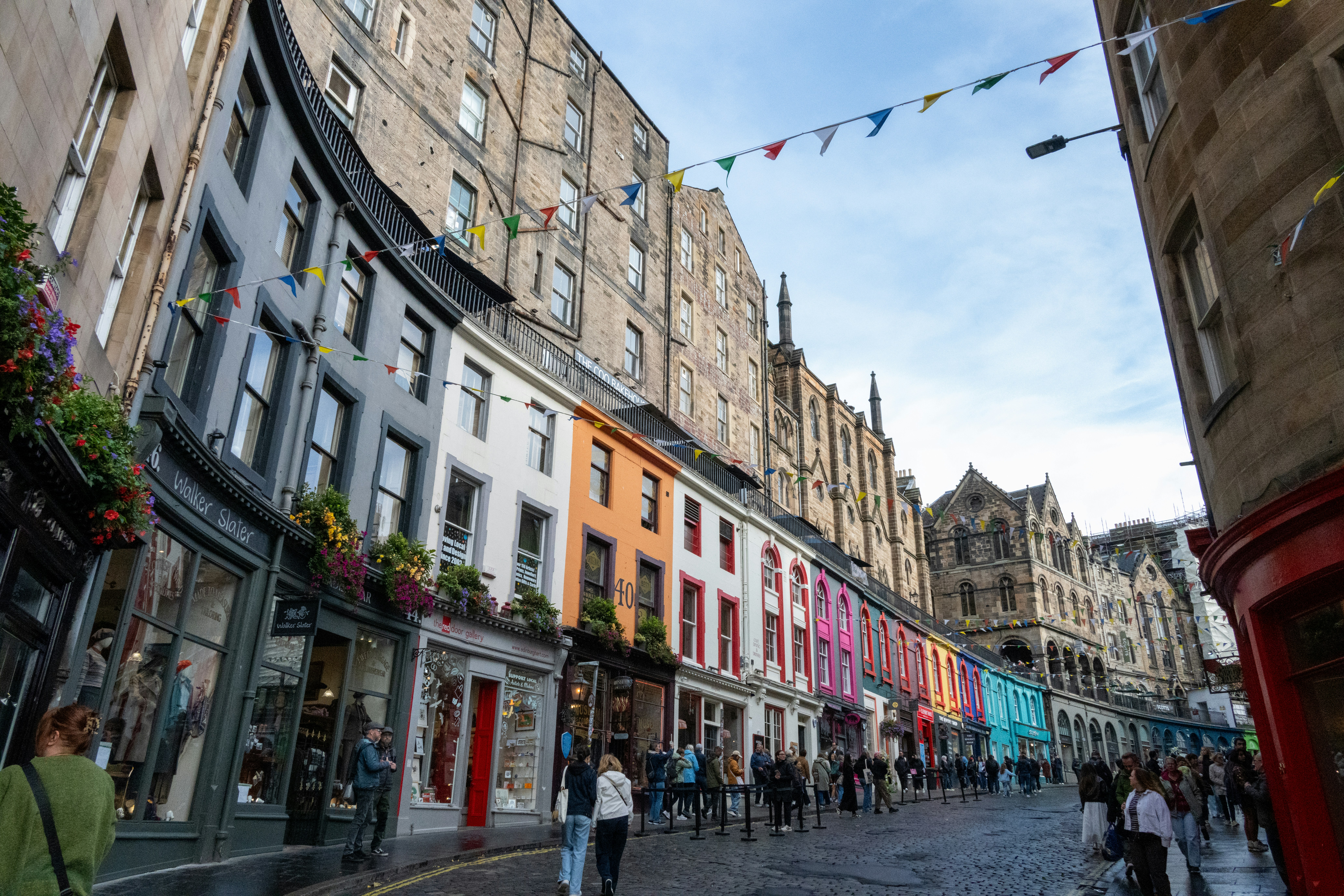 Colorful Crescent: A Lively Royal Mile Draped in Flags