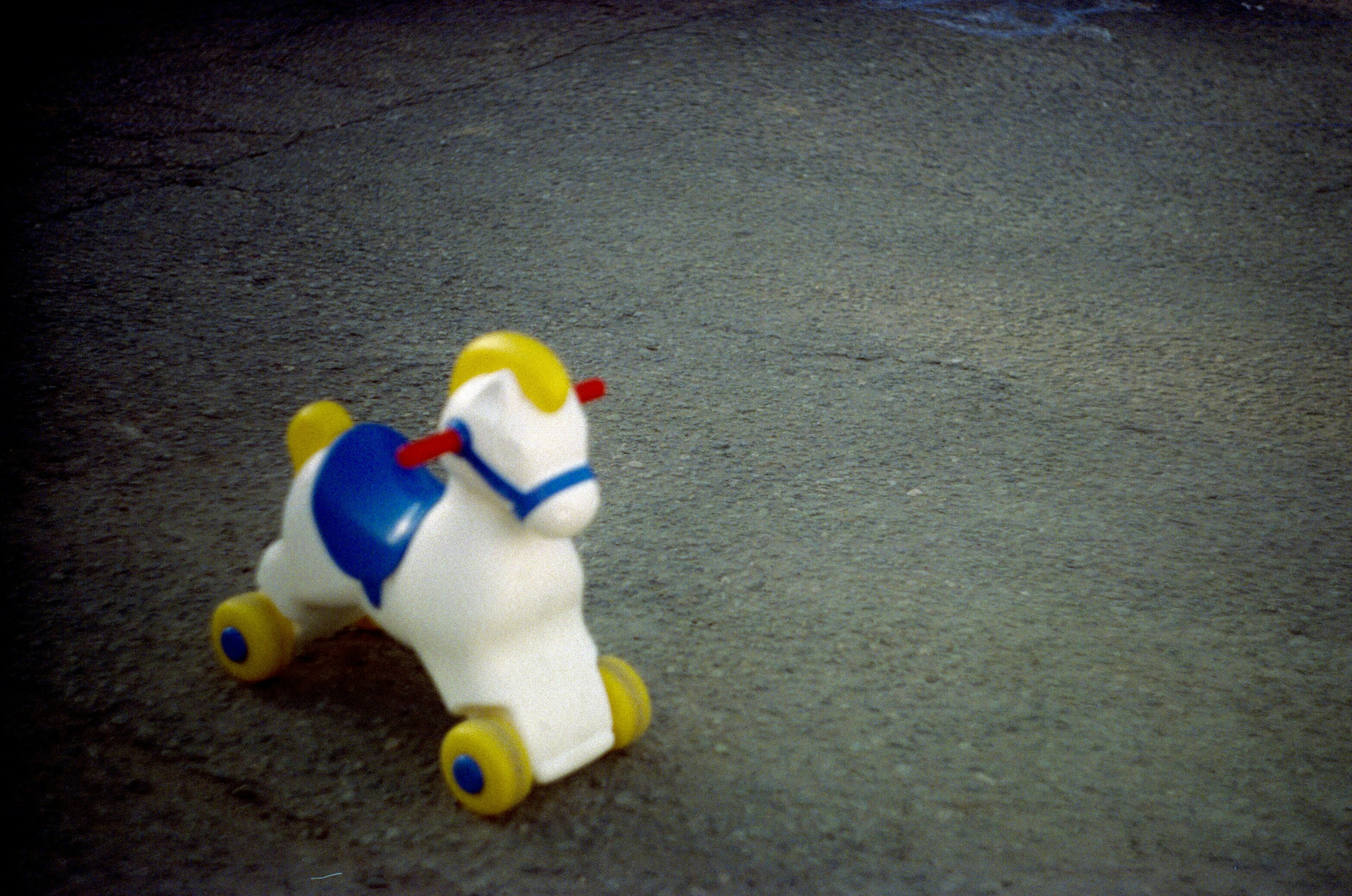 Tiny Fireplug: A Wandering Toy on a Quiet Shore